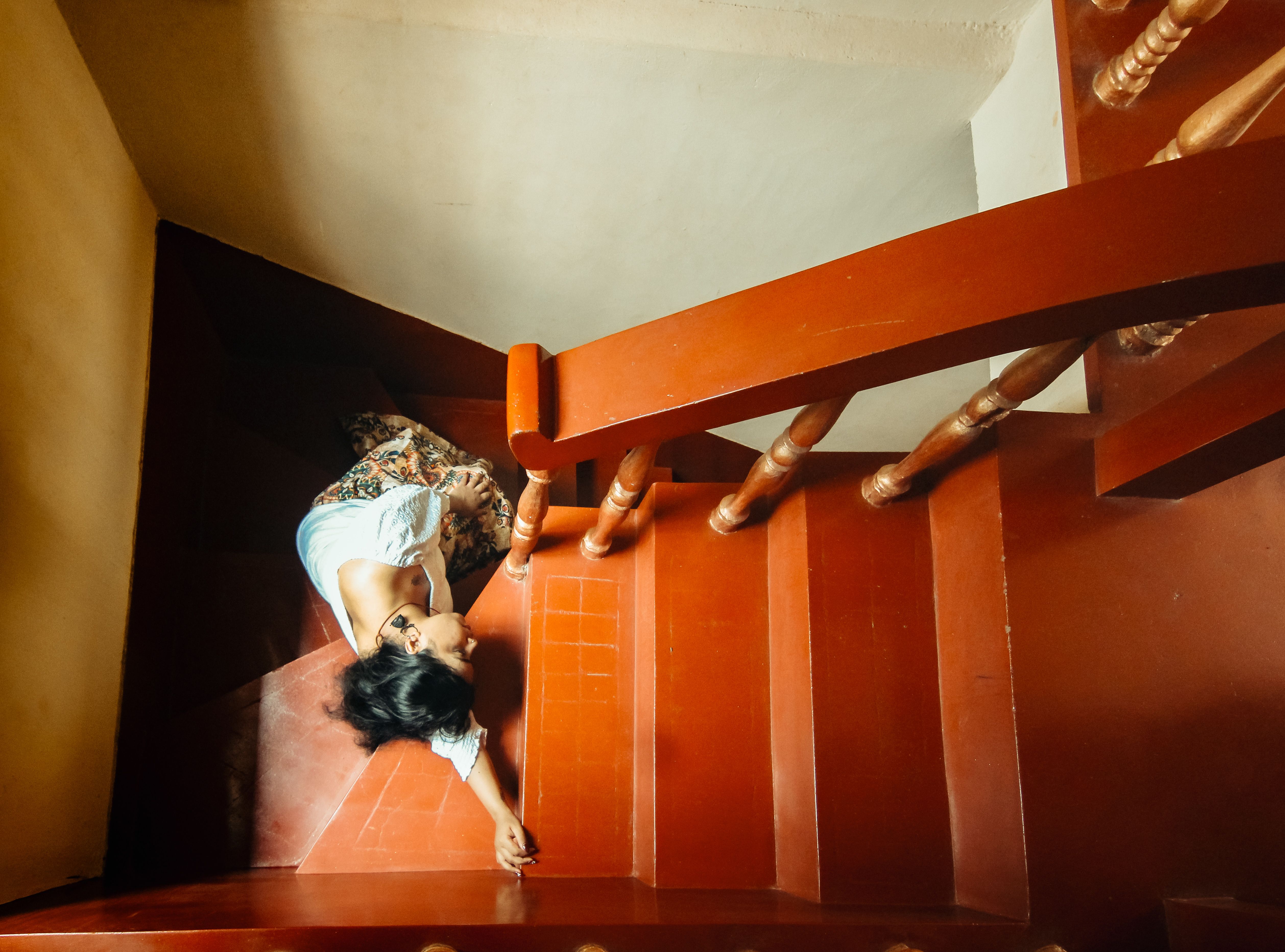 Woman Descending Rustic Staircase from Above · Free Stock Photo