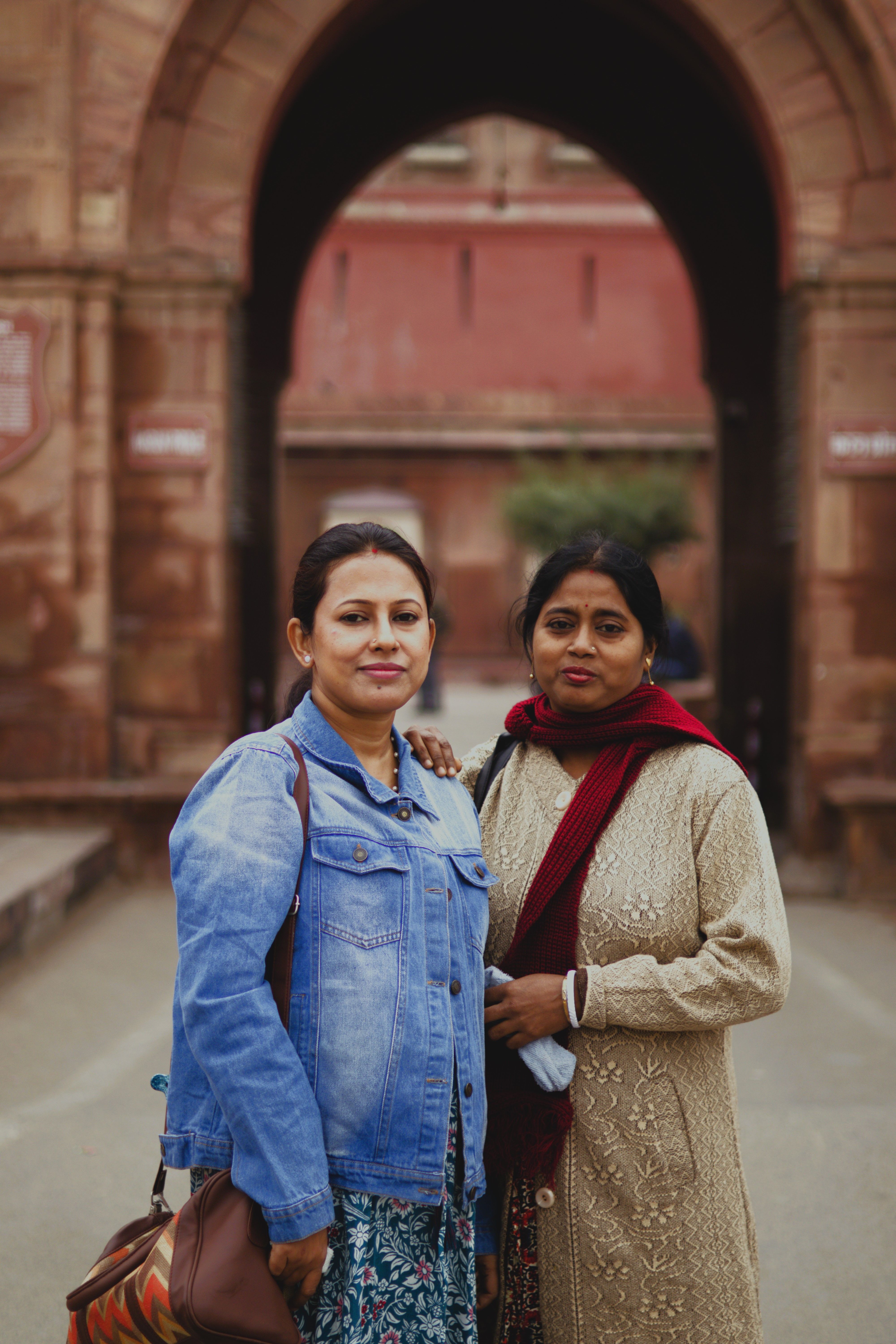 Women Posing at Historic Indian Fort Entrance · Free Stock Photo