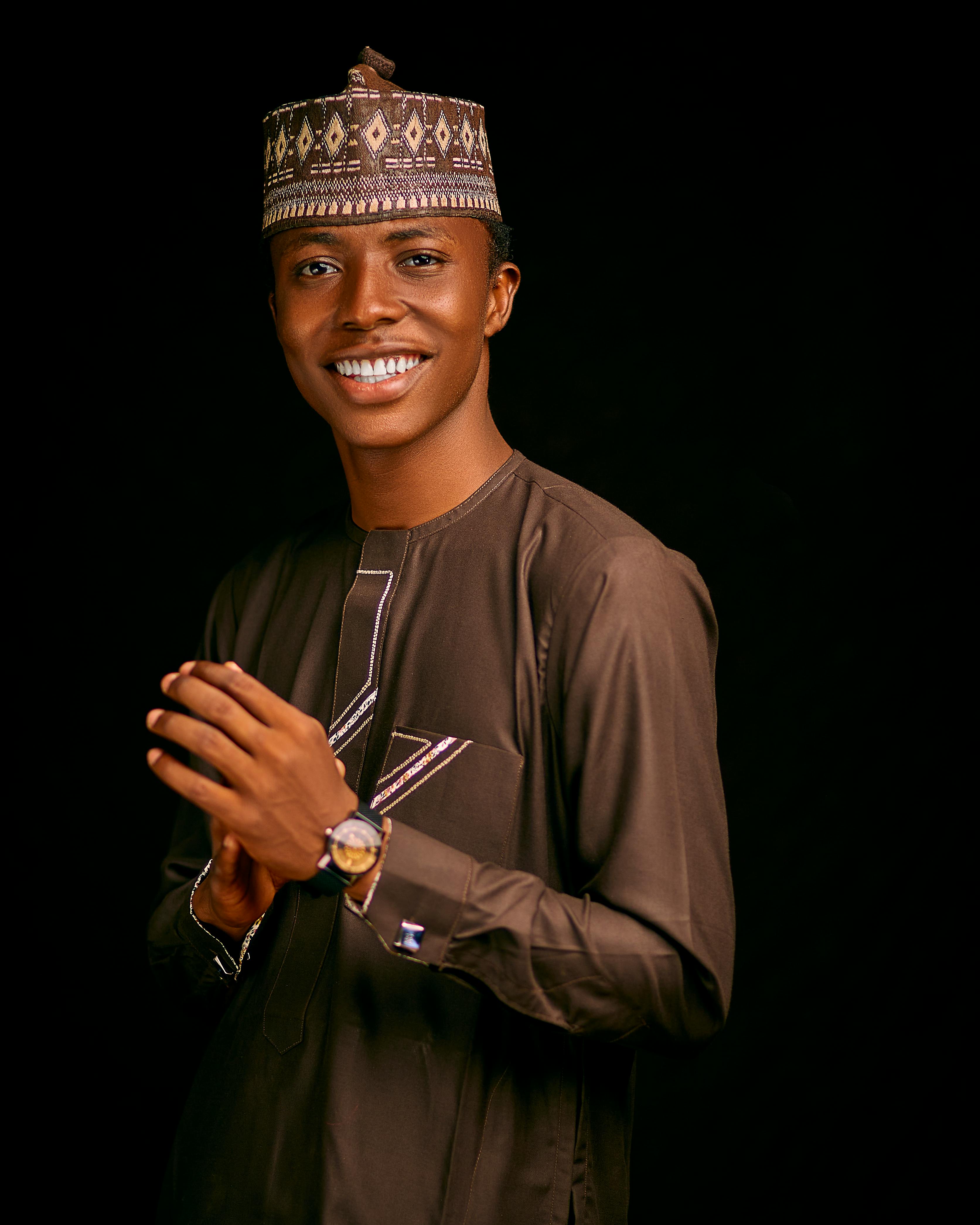 Portrait of a Smiling Nigerian Man in Traditional Attire · Free Stock Photo