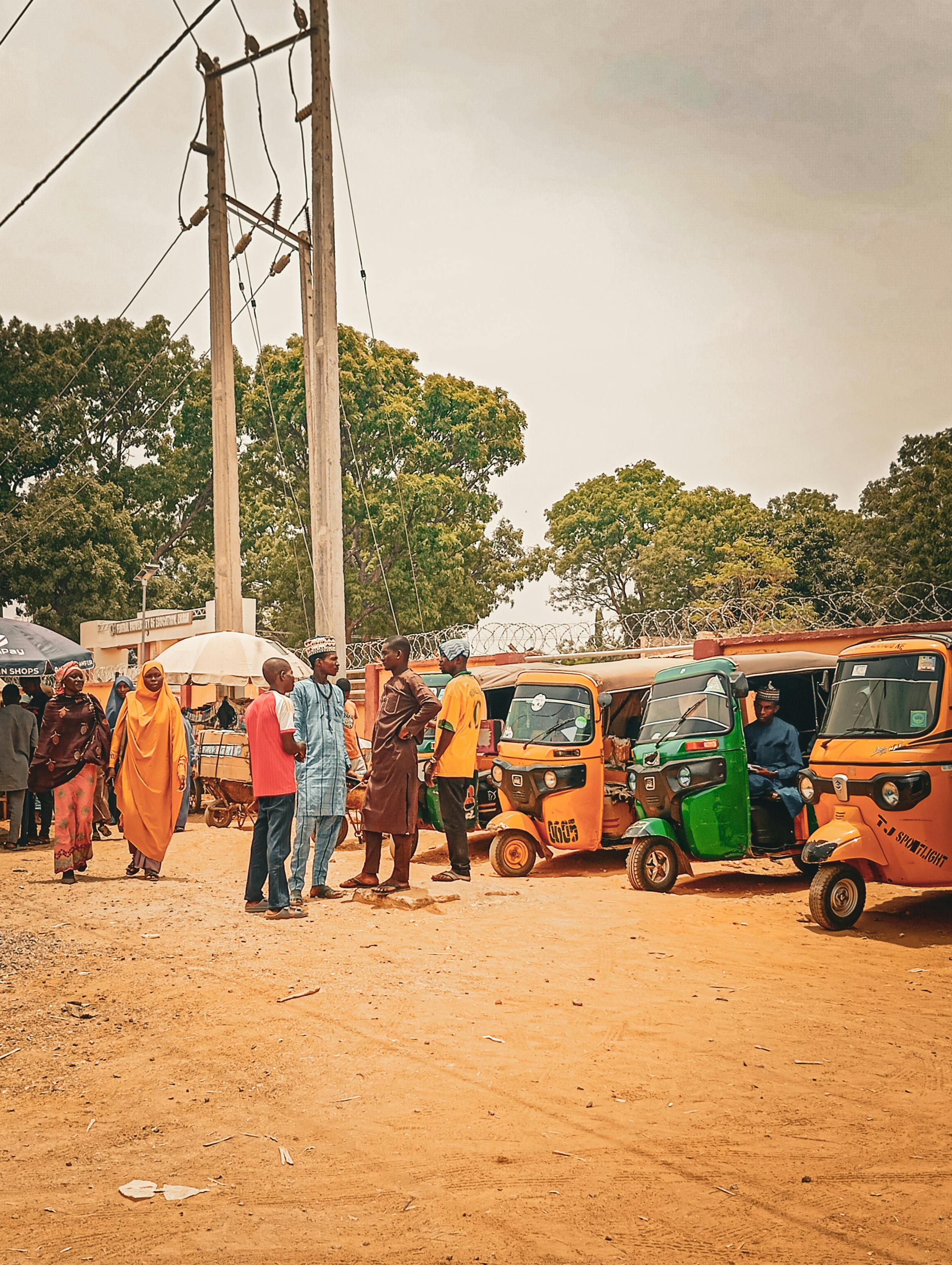 Vibrant Street Market with Colorful Rickshaws · Free Stock Photo