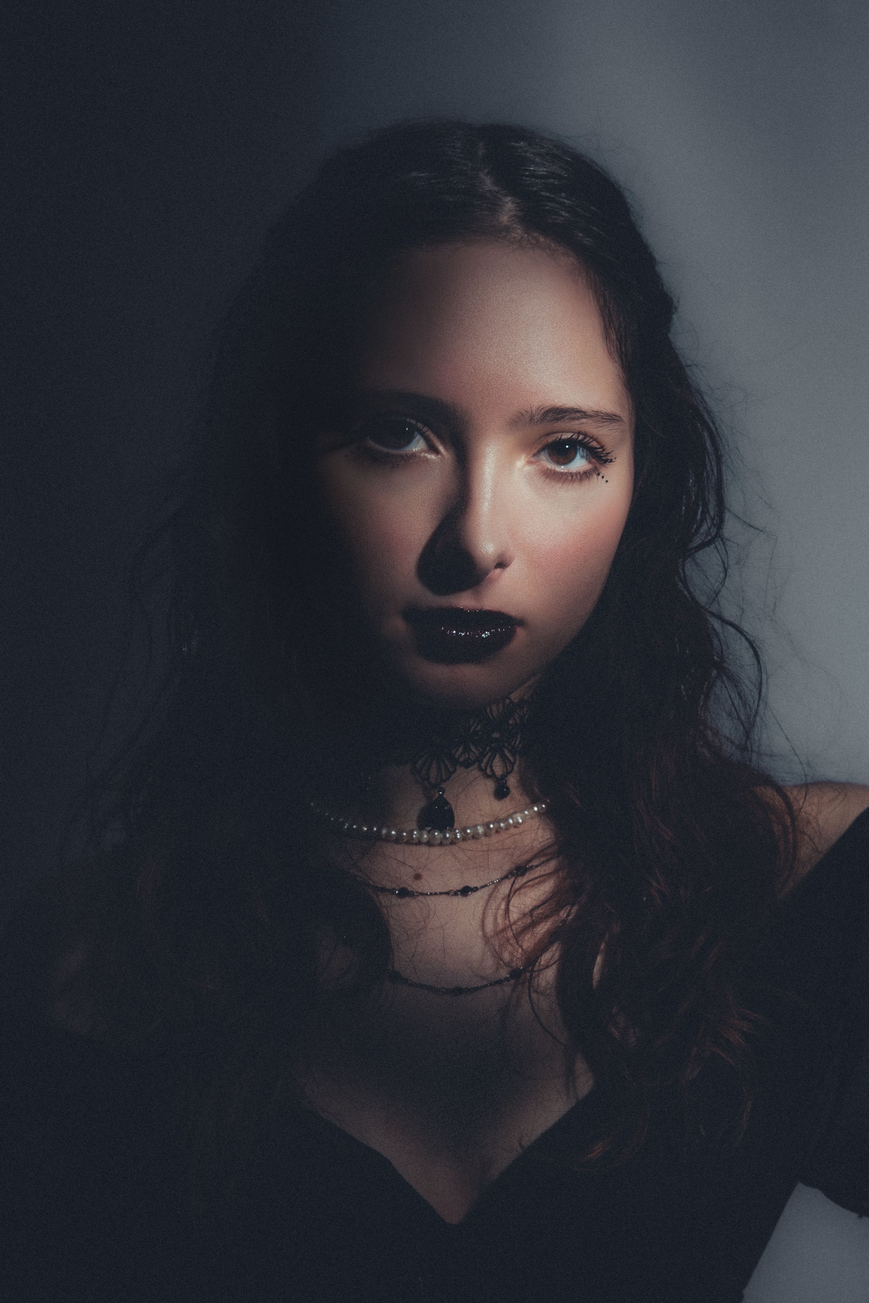 Dramatic Portrait of Woman in Shadow · Free Stock Photo