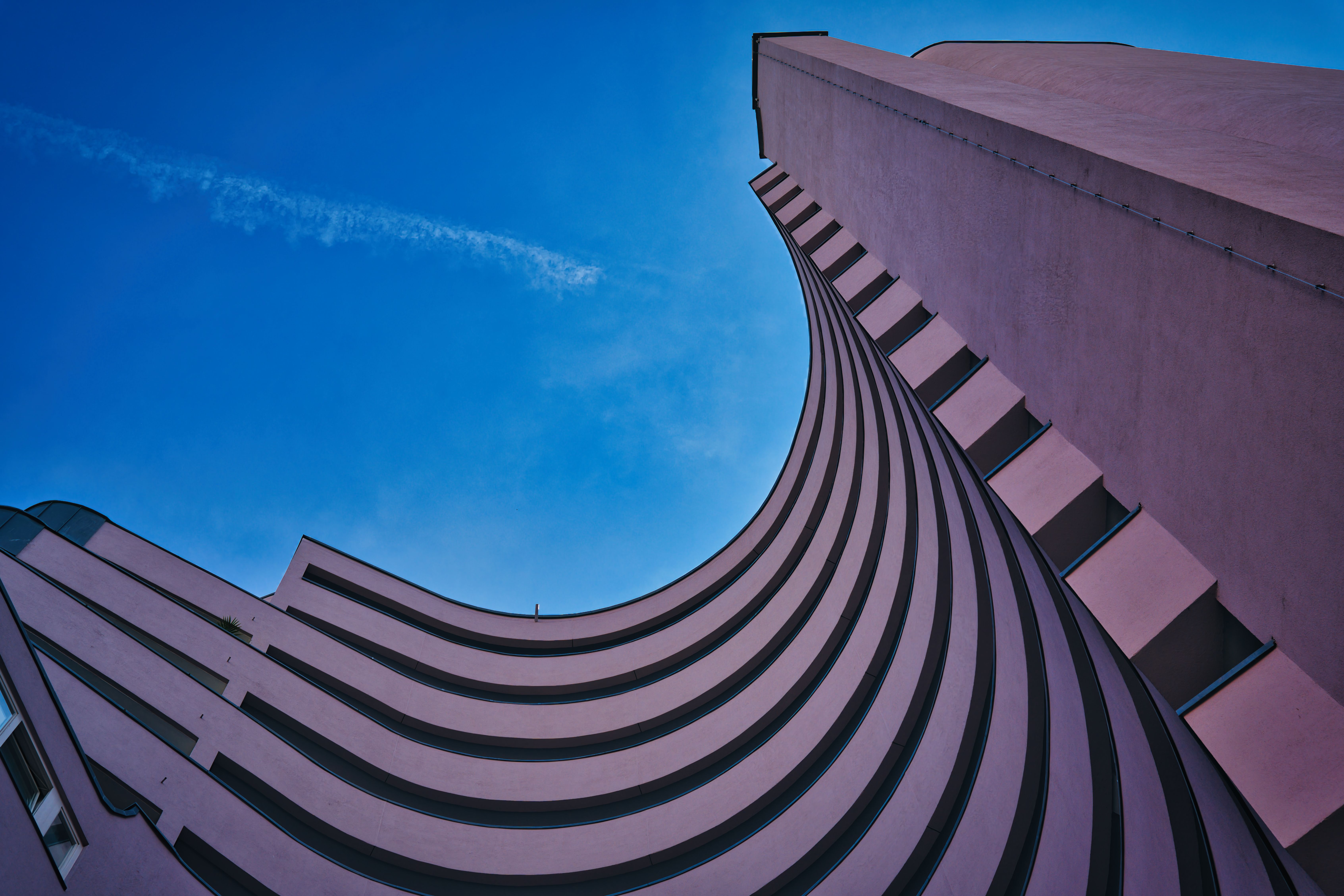 Curved Modern Building against Blue Sky · Free Stock Photo