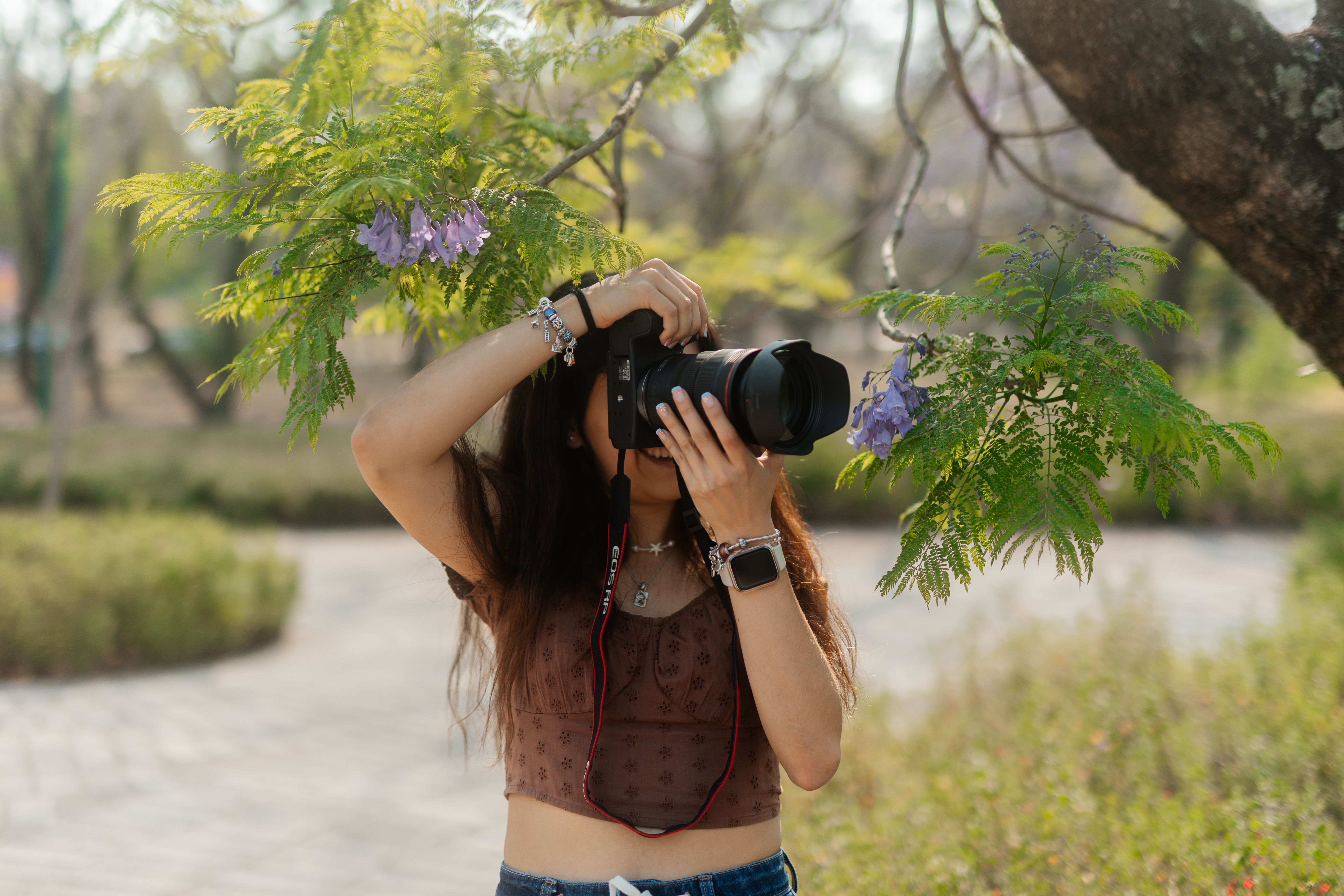 Young Woman Photographer Capturing Nature · Free Stock Photo