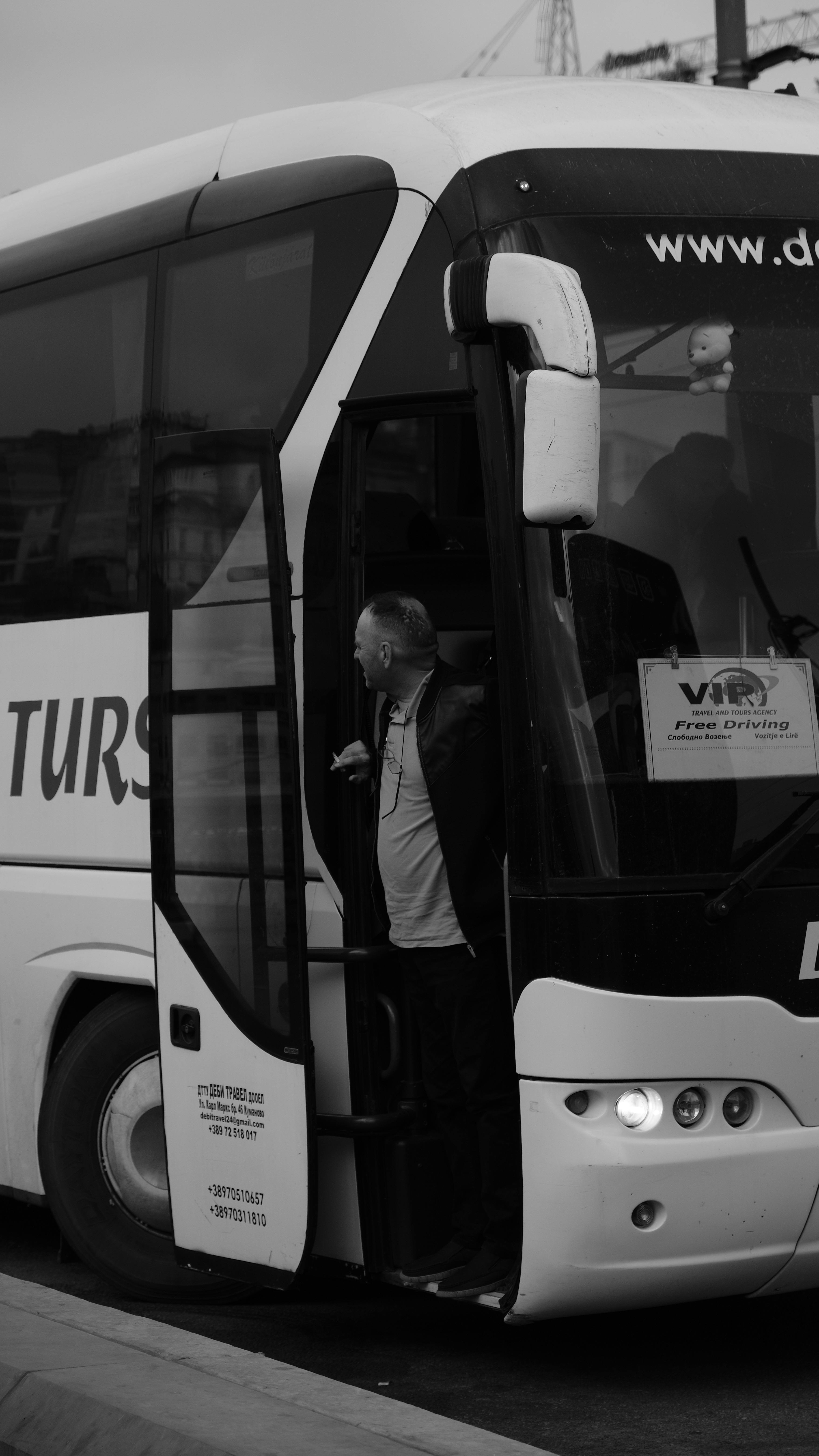 Black and White Image of Bus with Passenger Exiting · Free Stock Photo