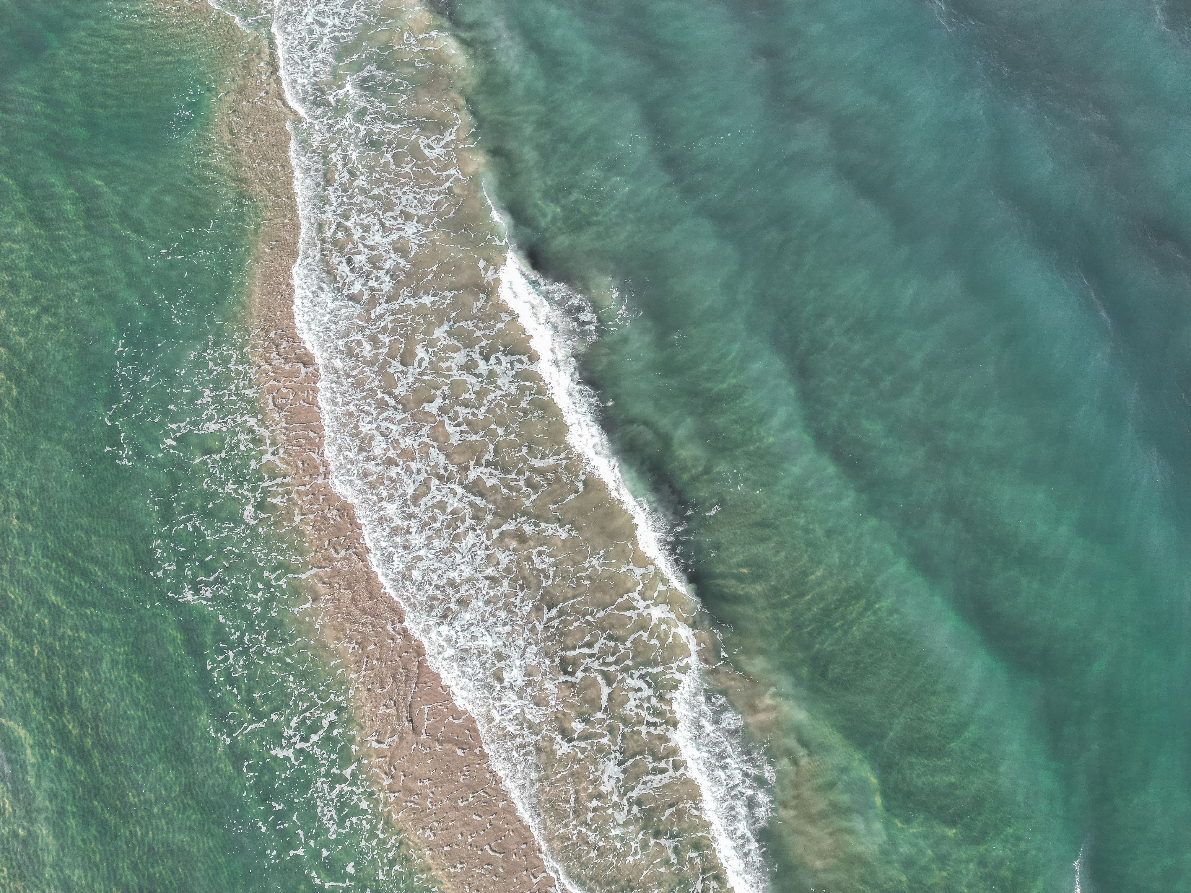 Aerial View of Tropical Ocean Waves and Shoreline · Free Stock Photo