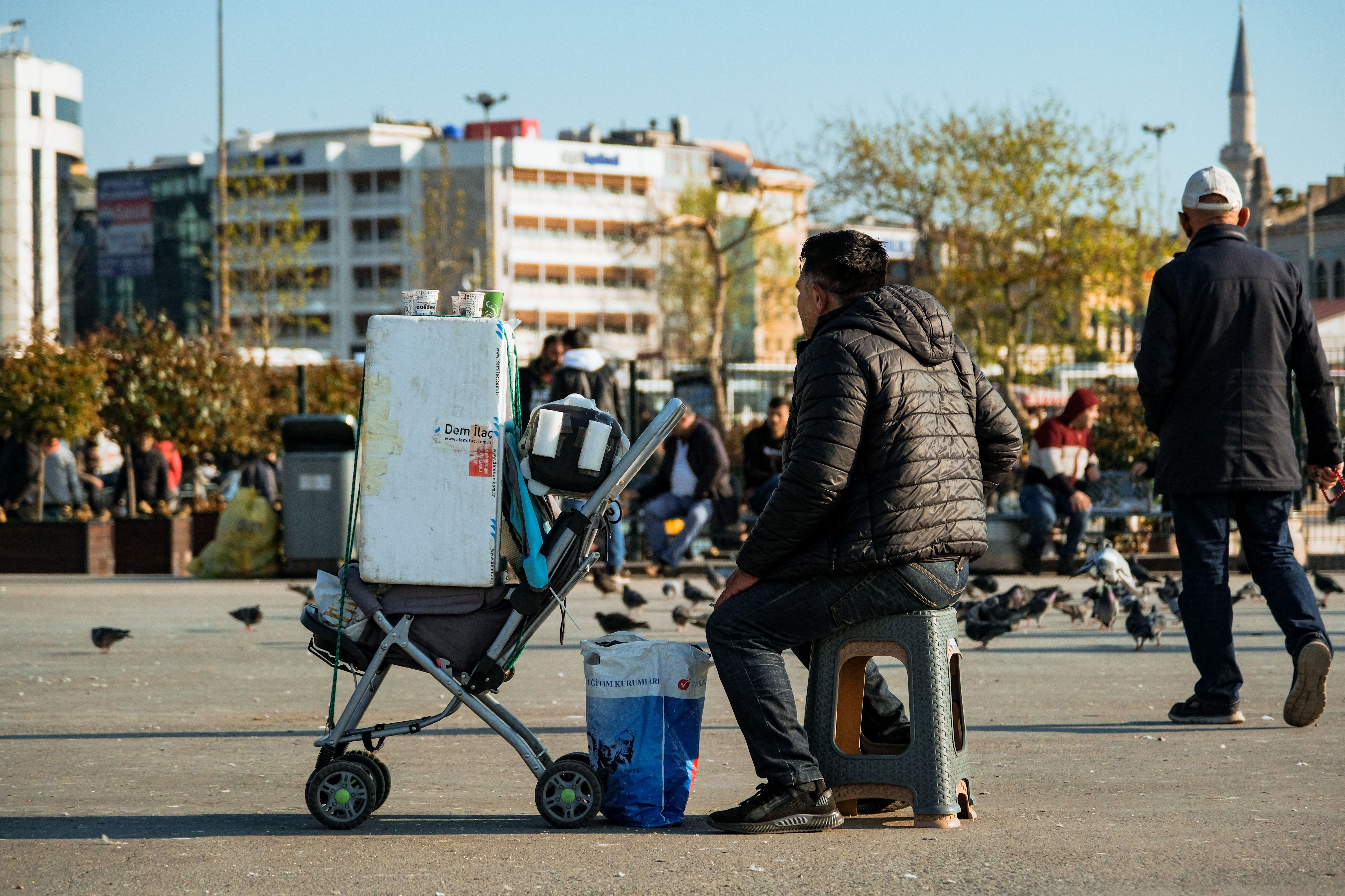 Street Vendor Selling Snacks in City Park · Free Stock Photo
