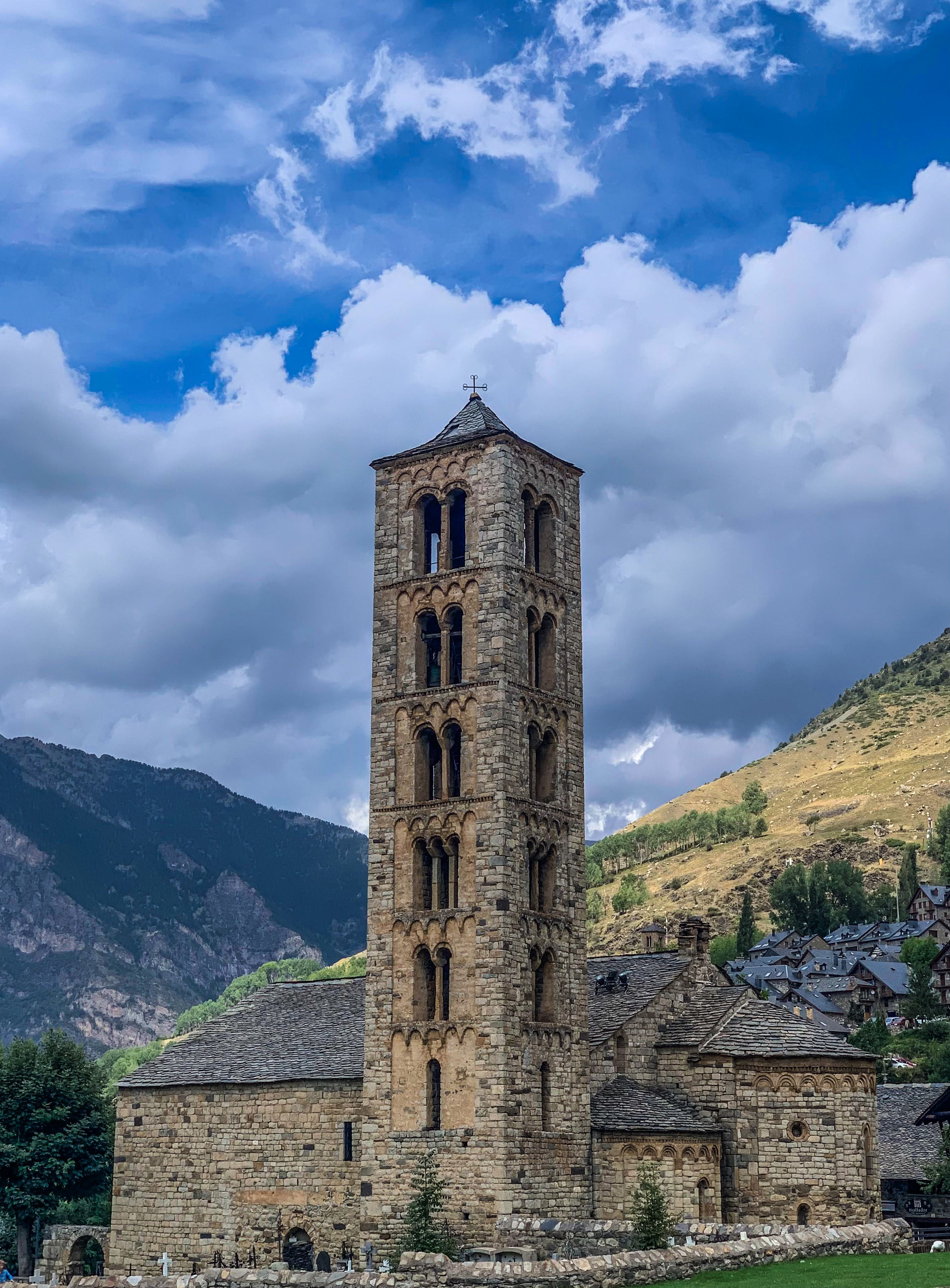 Romanesque Church Tower in Mountainous Landscape · Free Stock Photo