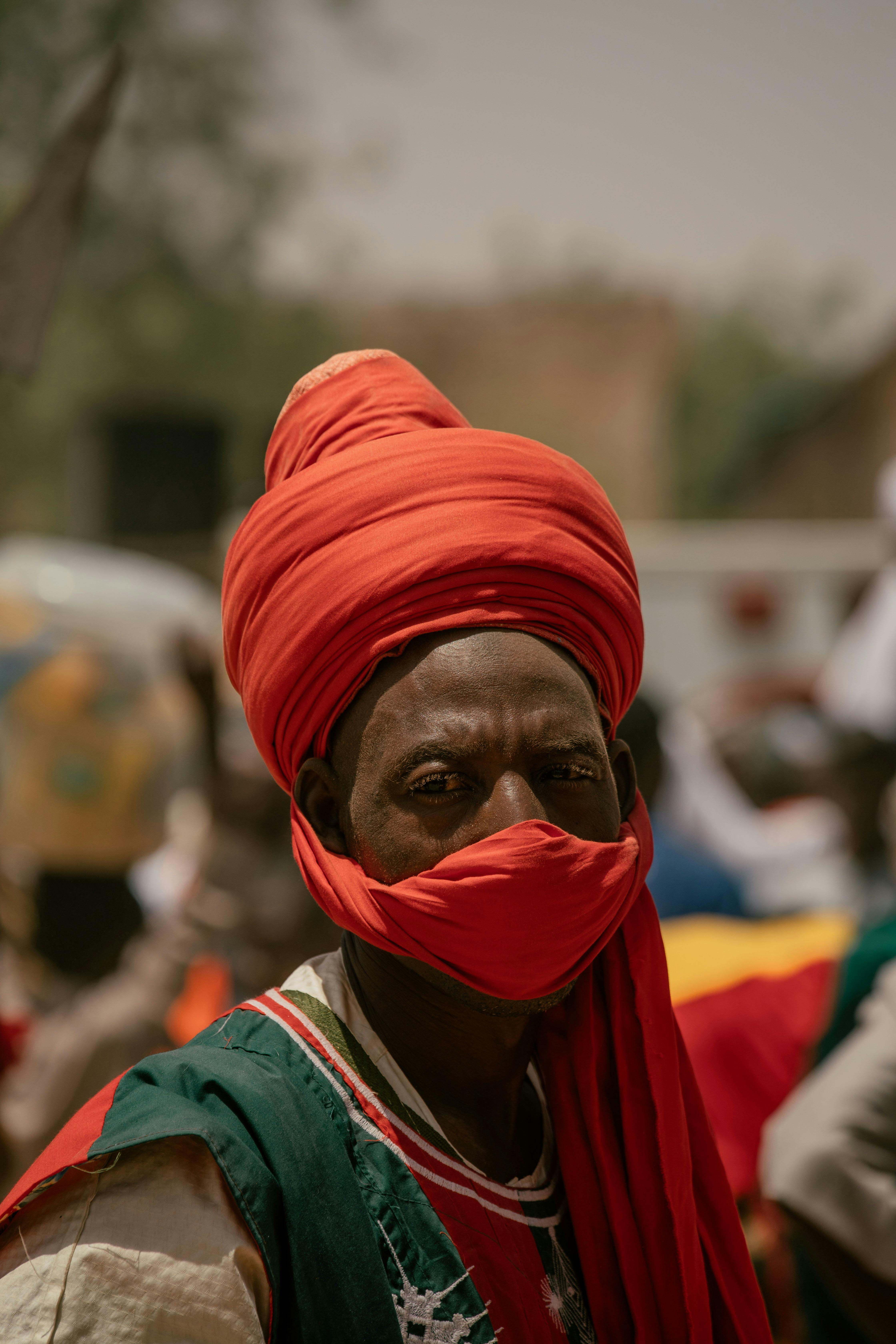Vibrant Traditional Attire in African Street Festival · Free Stock Photo