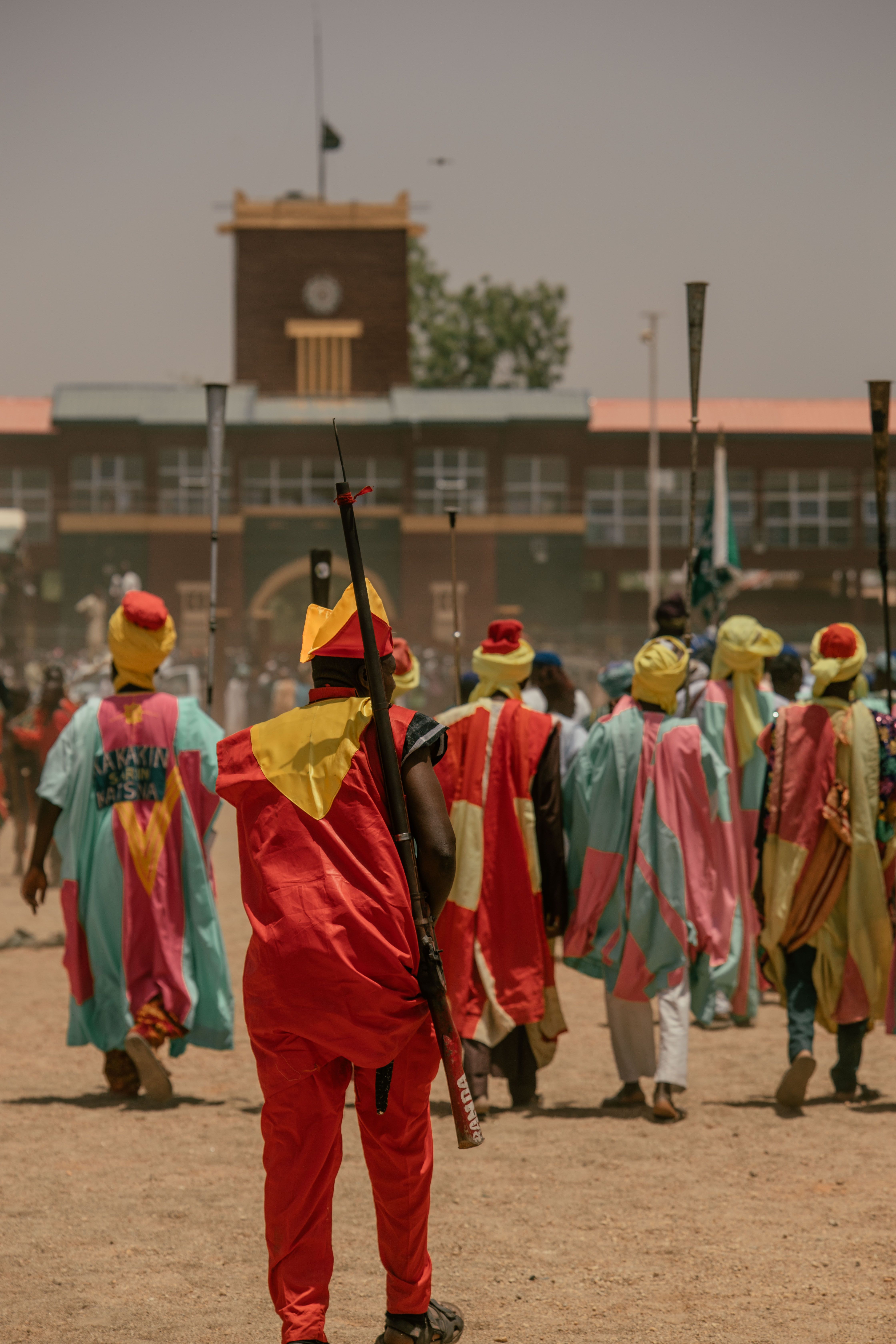Colorful Cultural Parade in Historical Setting · Free Stock Photo