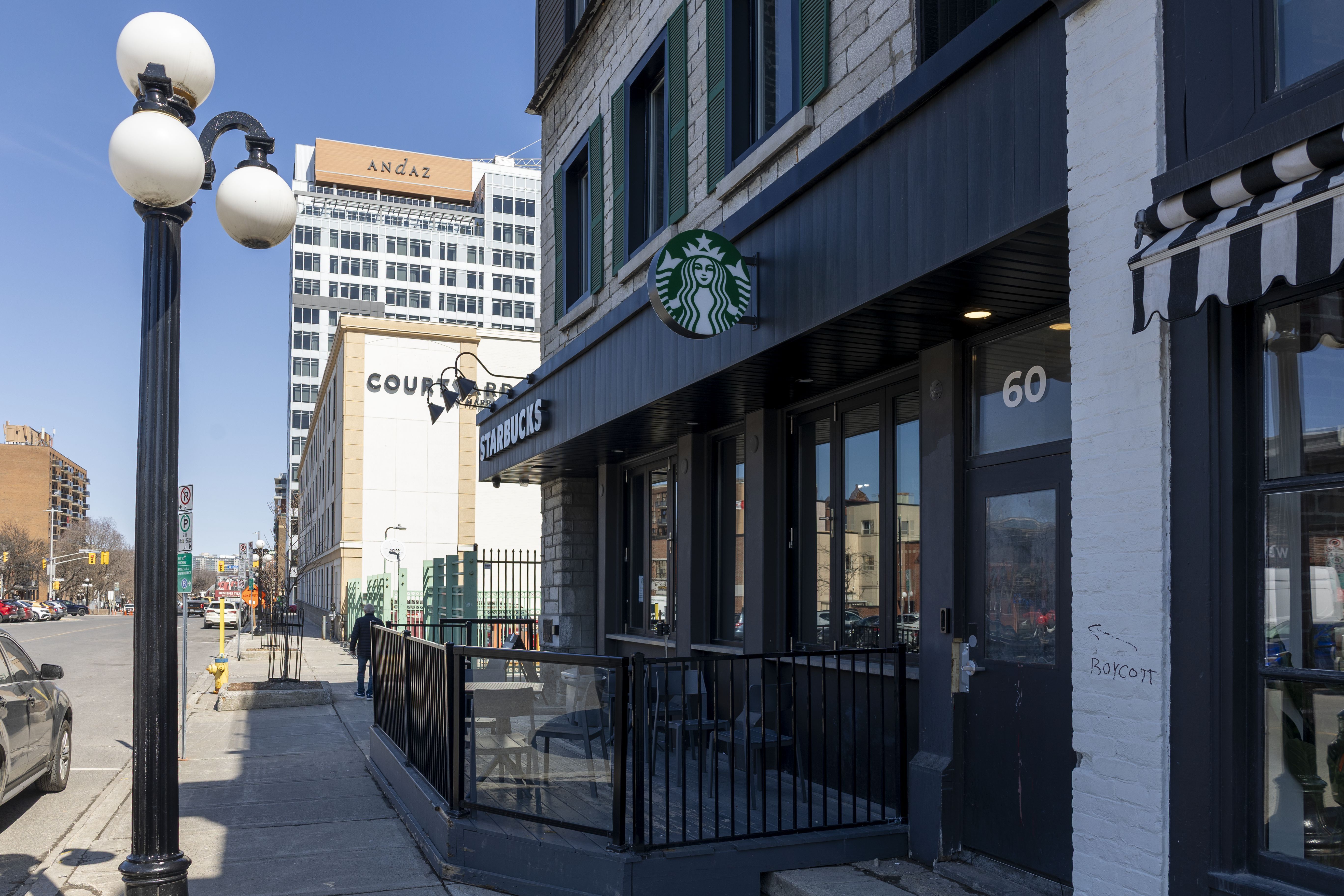 Street View of City Starbucks Cafe Exterior · Free Stock Photo
