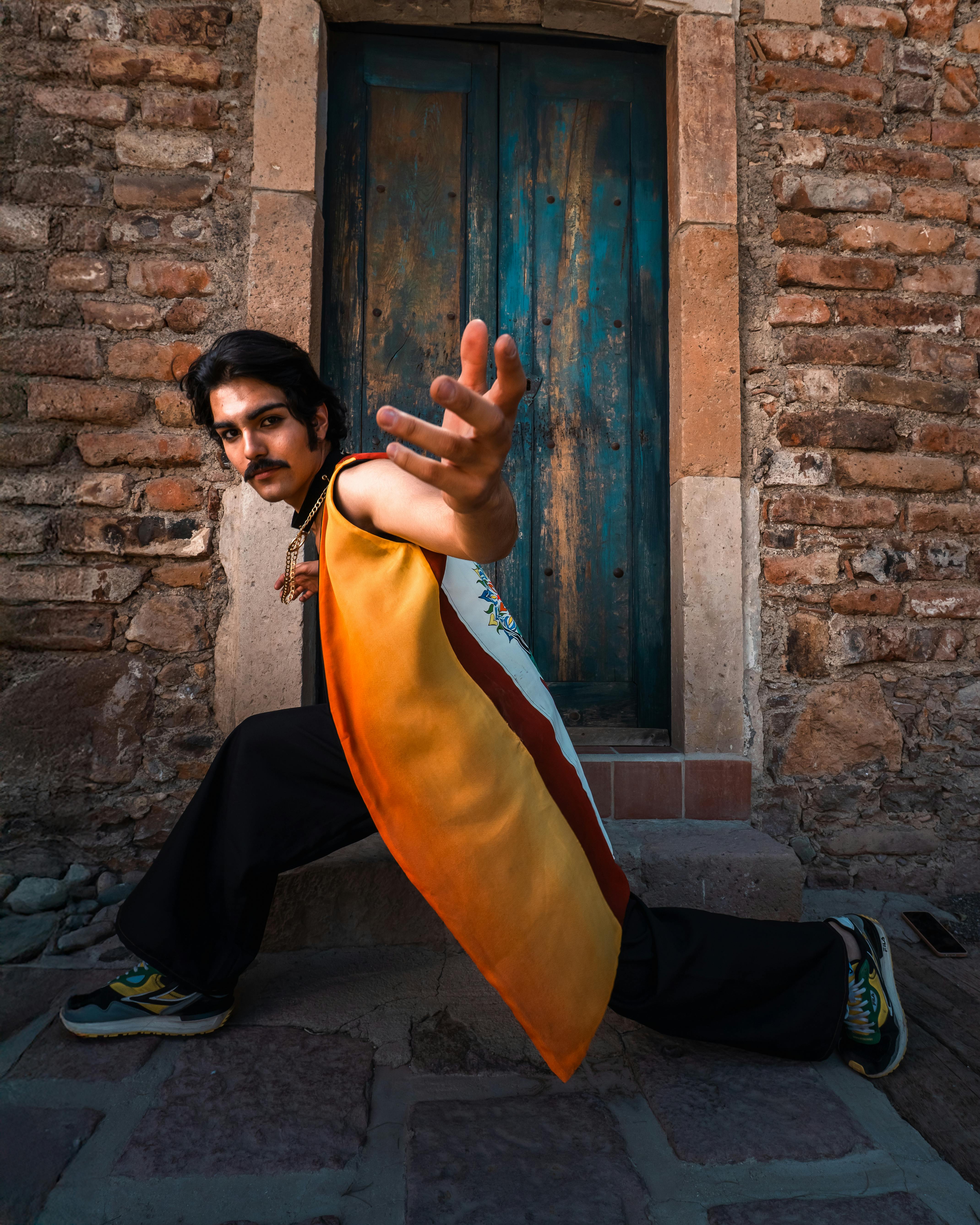 Dynamic Pose of Latin Male in Traditional Costume · Free Stock Photo