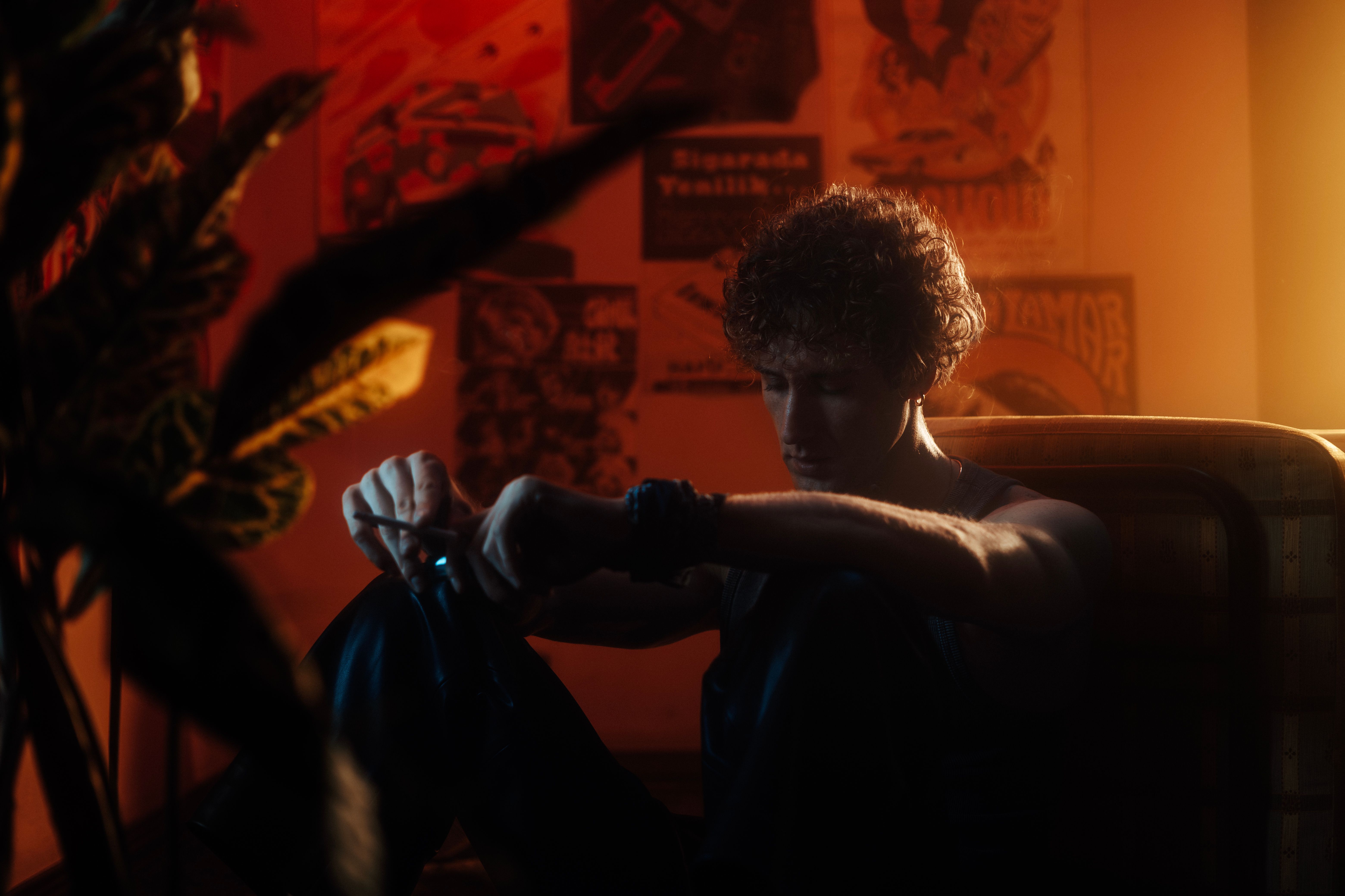 Moody Portrait of Man in Dimly Lit Room · Free Stock Photo