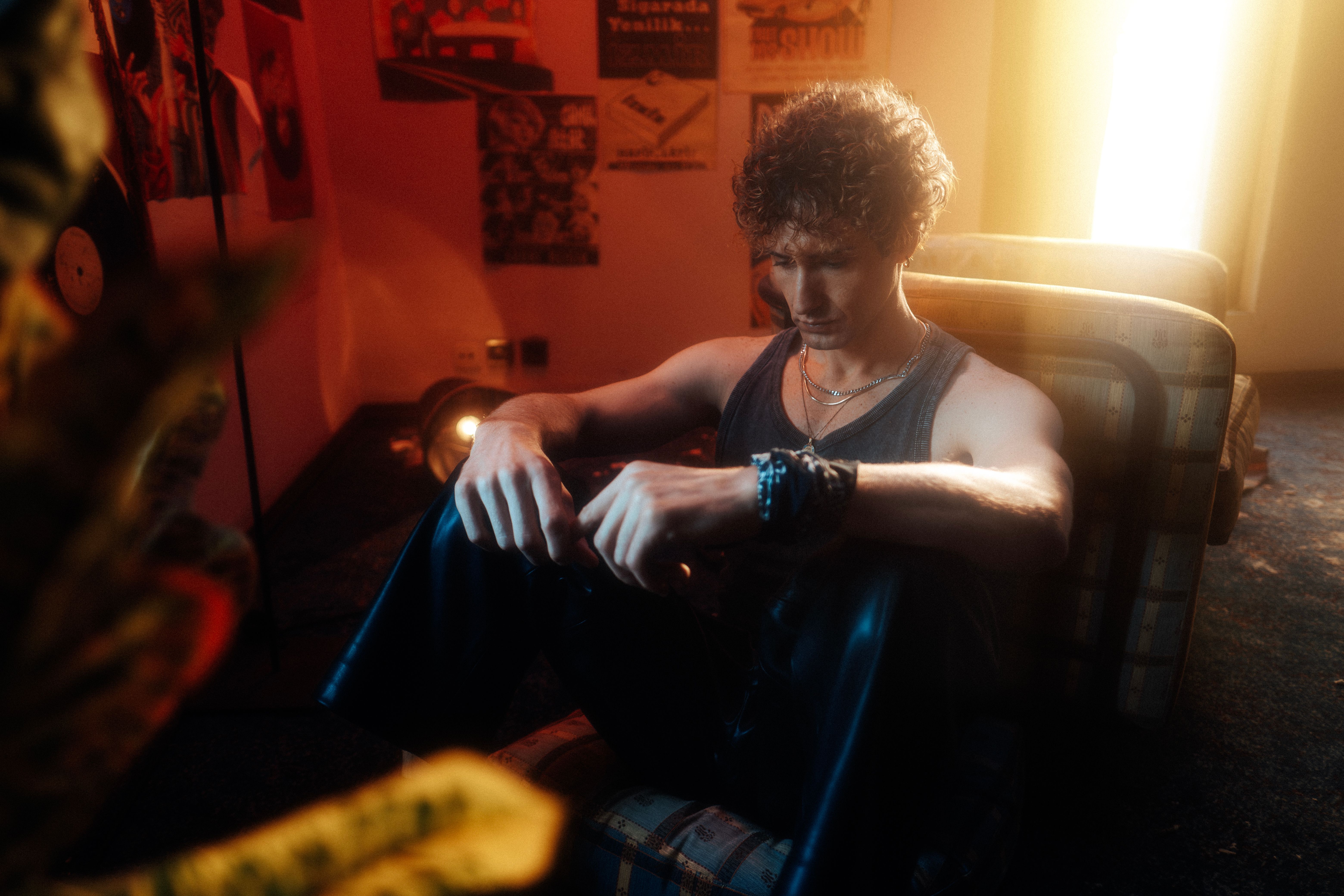 Moody Portrait of a Man in a Dimly Lit Room · Free Stock Photo