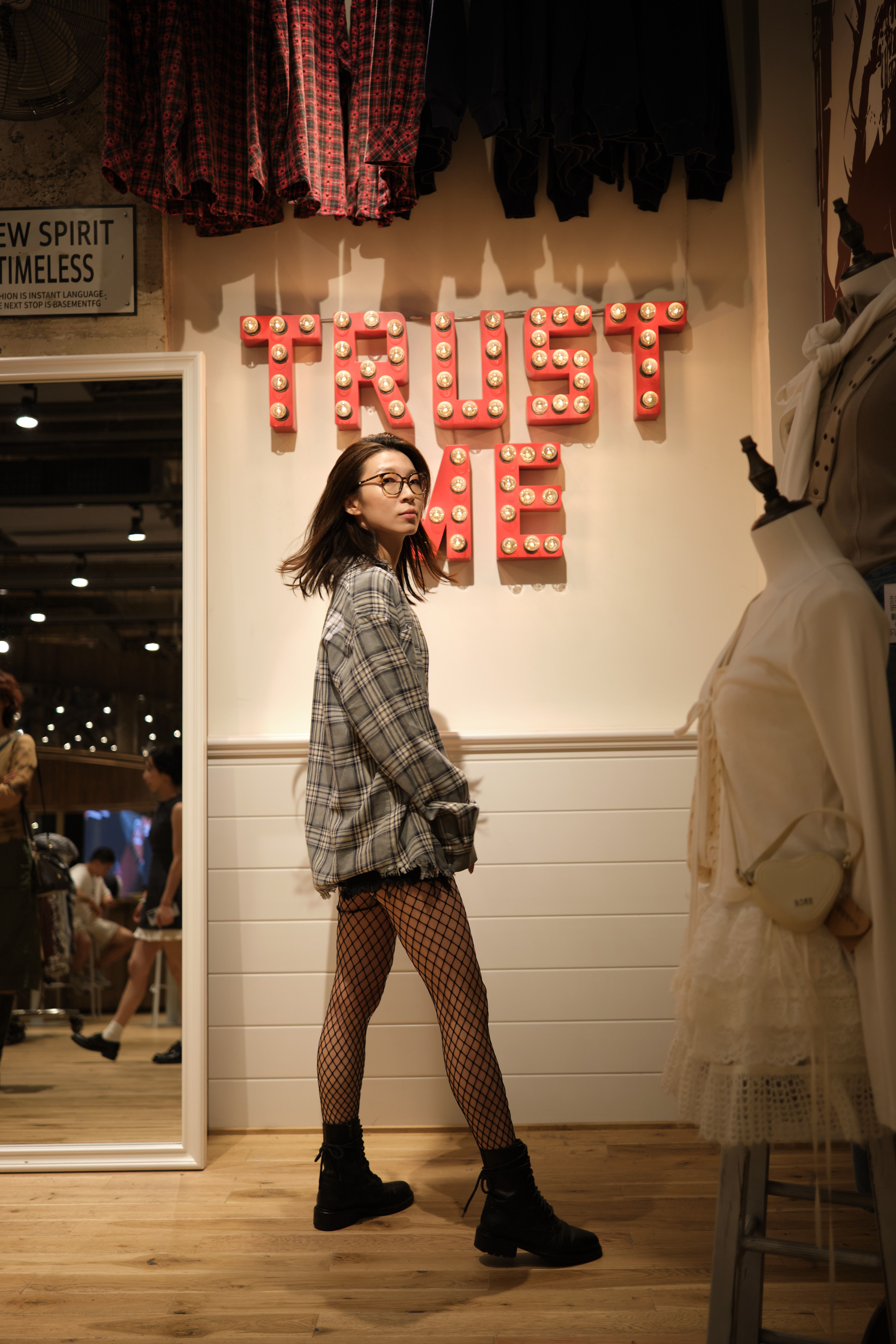 Trendy Fashion Store Interior with "Trust Me" Sign · Free Stock Photo