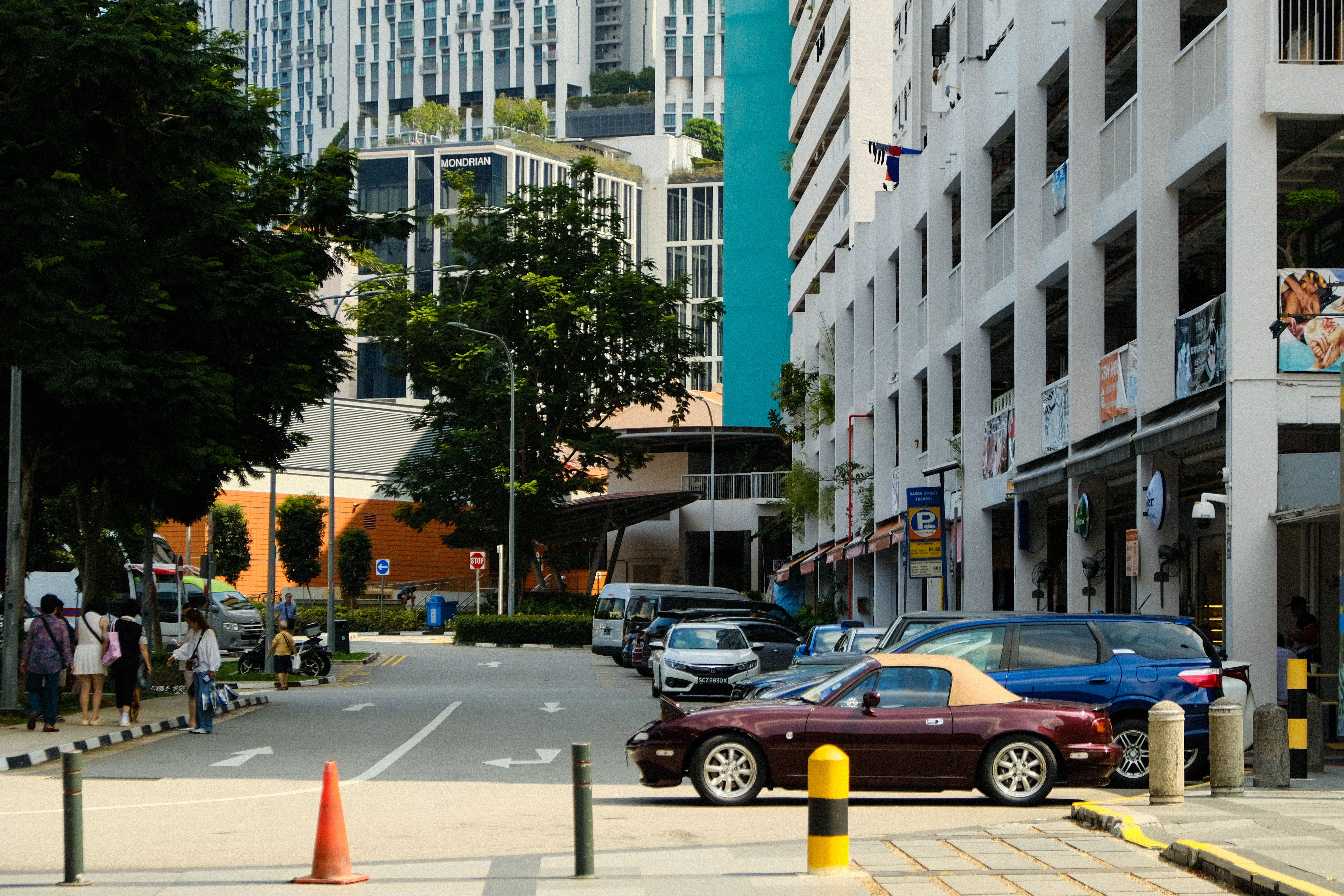 Bustling Urban Street in Modern Cityscape · Free Stock Photo