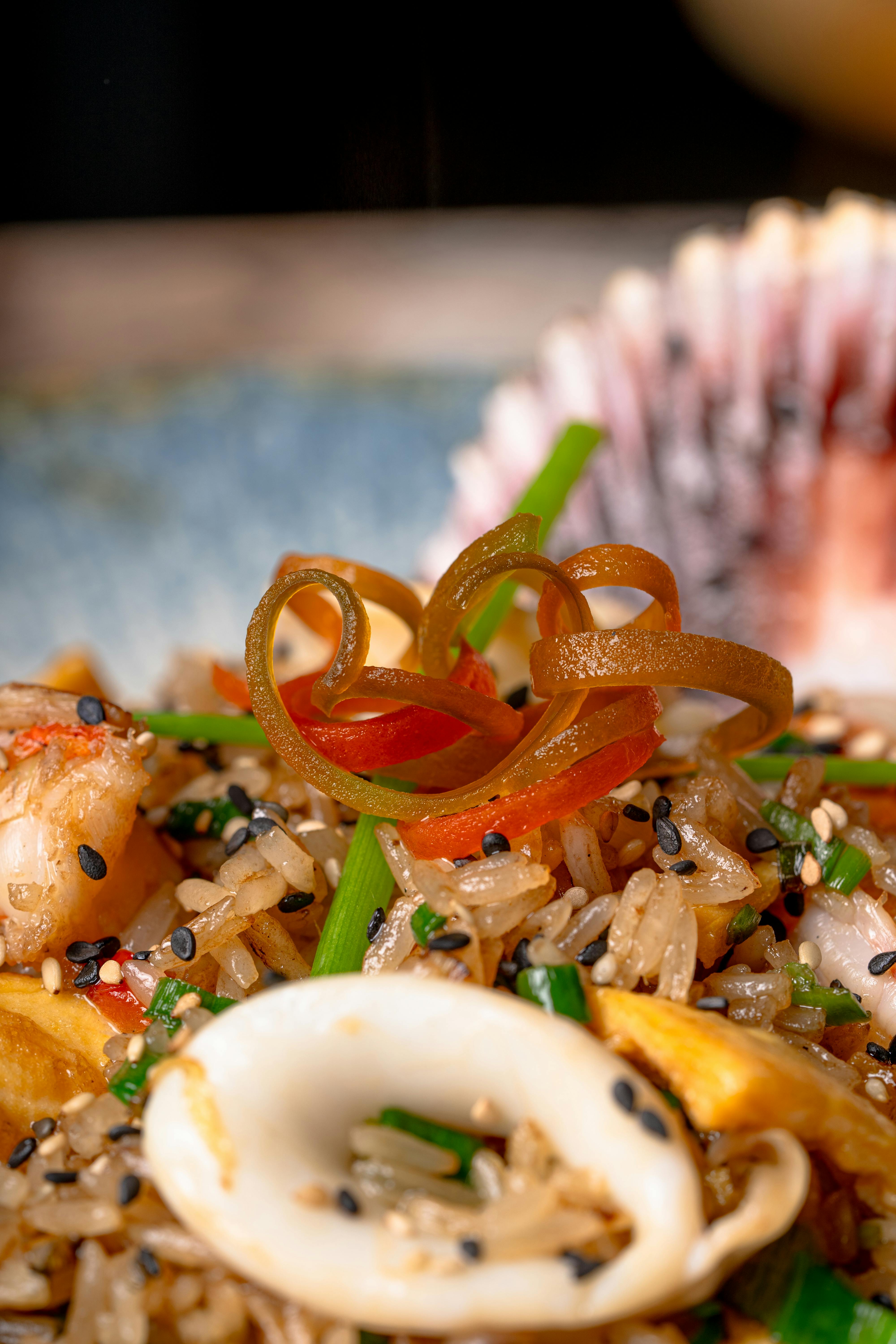 Close-up of Seafood Rice Dish with Garnish · Free Stock Photo