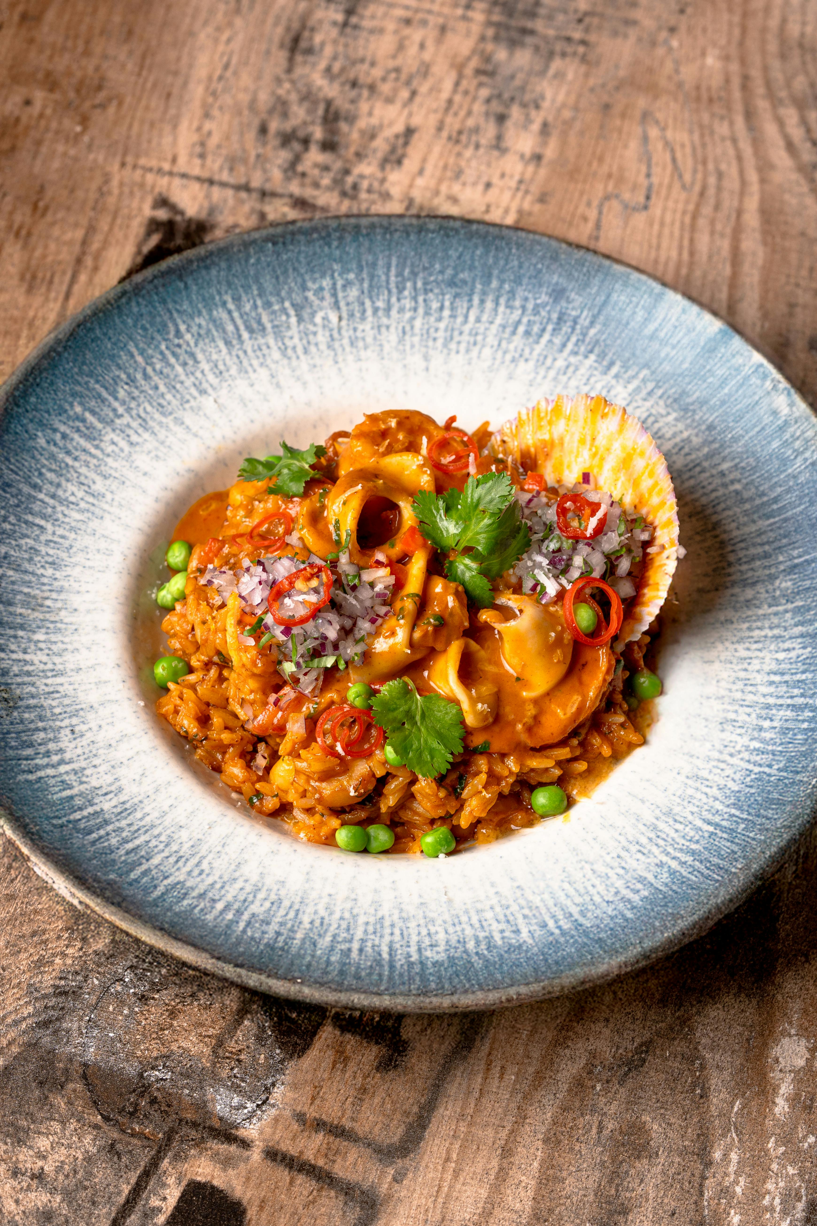 Colorful Seafood Risotto with Peas and Chili · Free Stock Photo