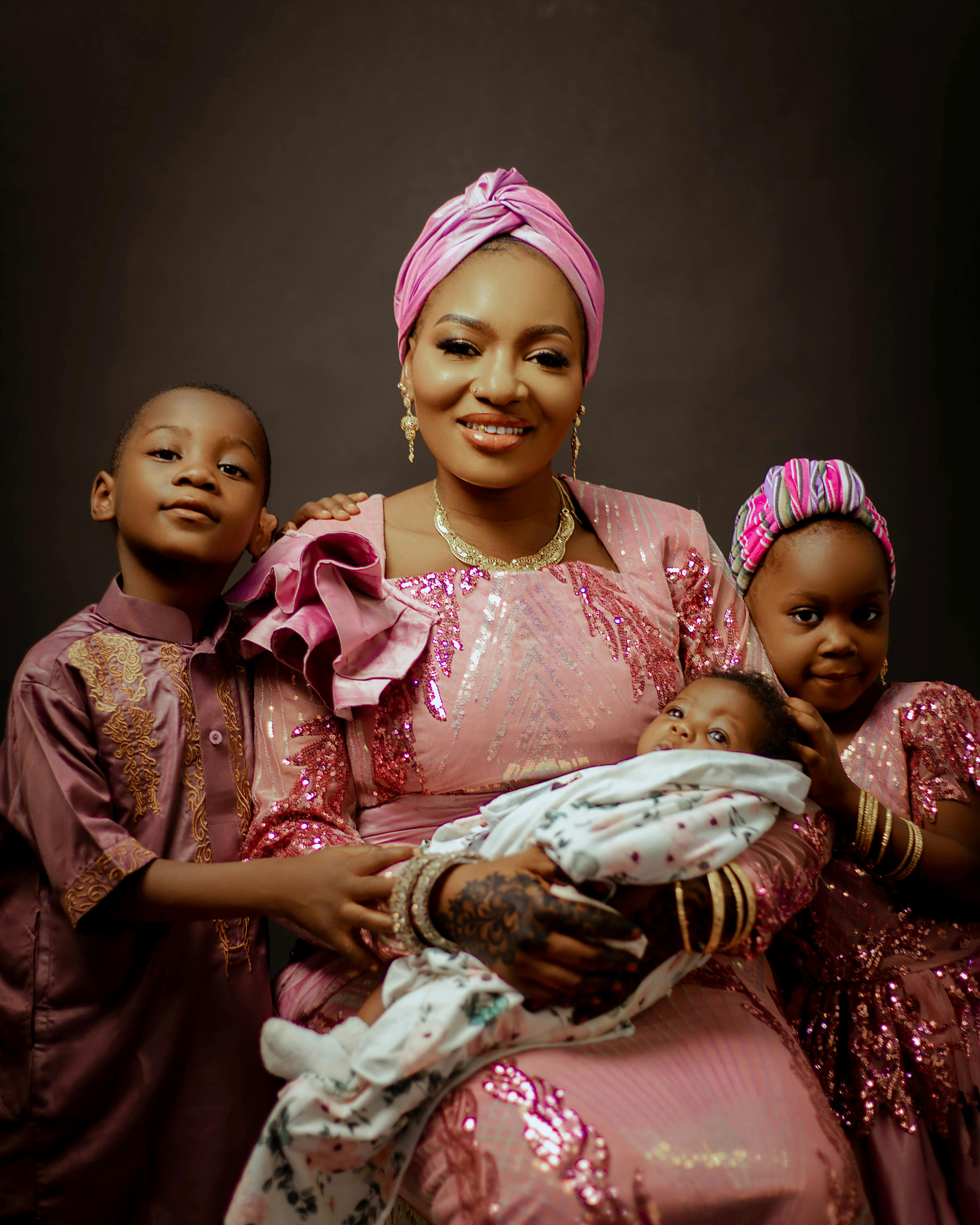 Beautiful Family Portrait in Traditional Attire · Free Stock Photo