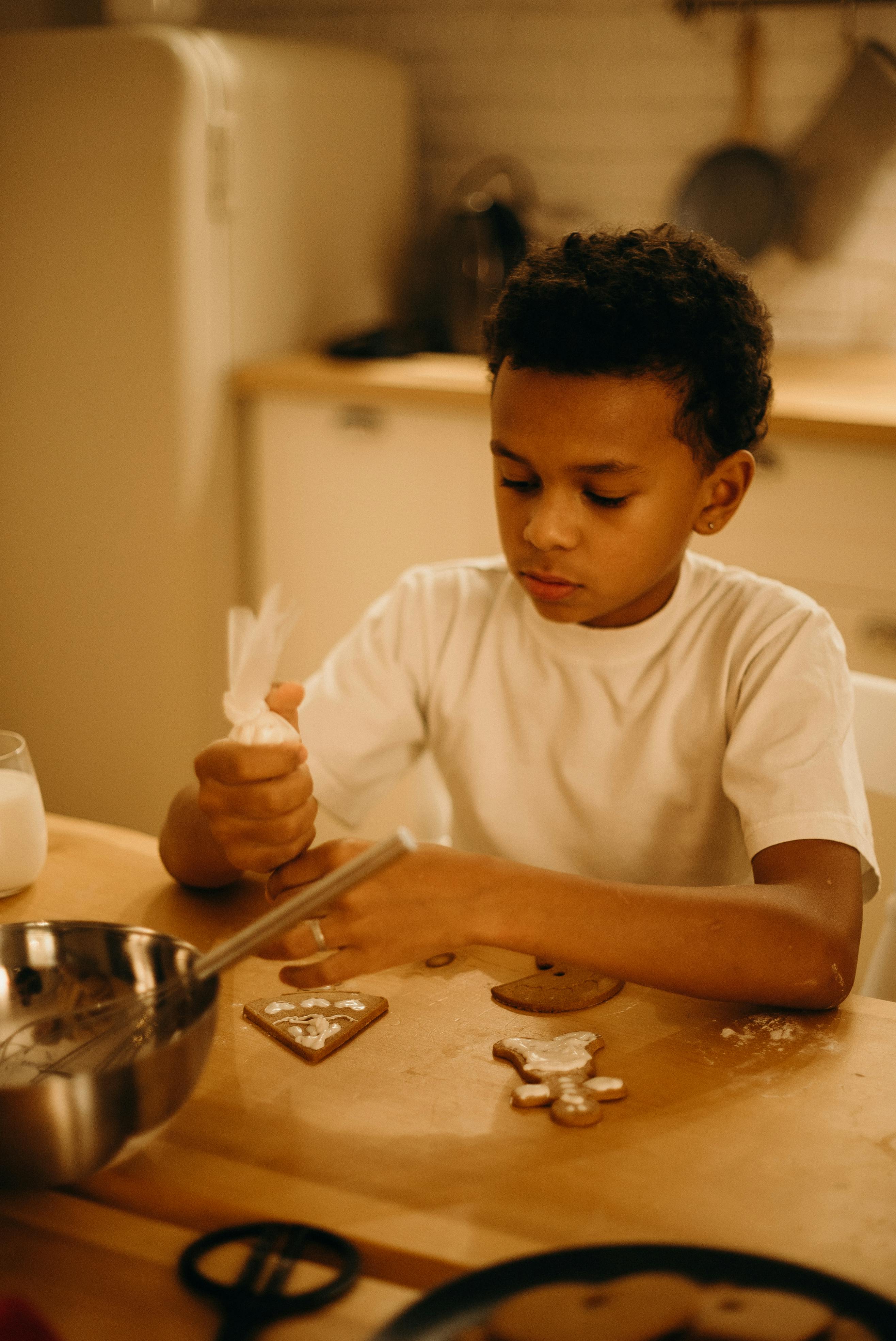 Selective Focus Photography of Boy Beside Table With Cookies · Free ...