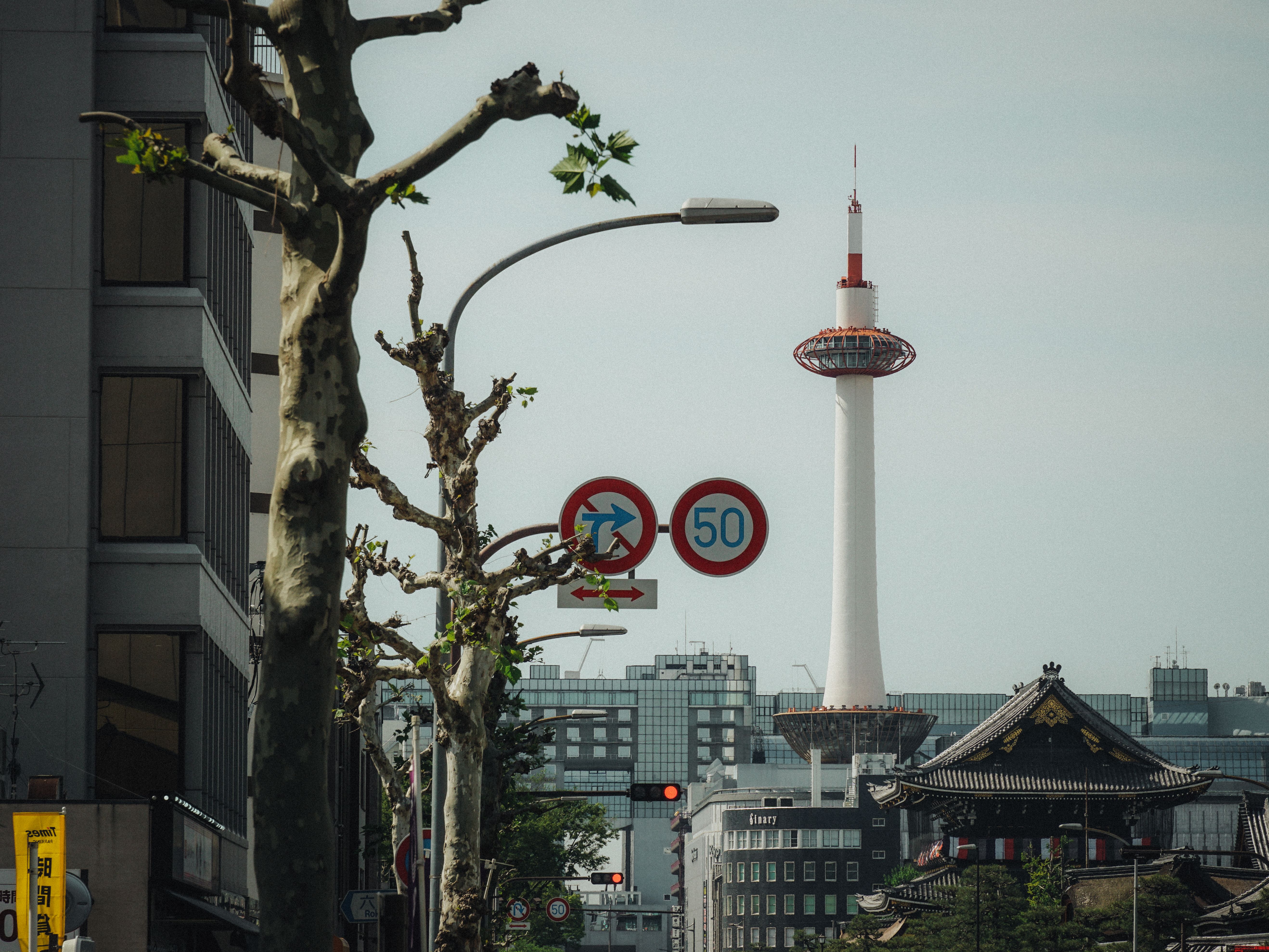 Kyoto Tower in Urban Cityscape of Kyoto, Japan · Free Stock Photo