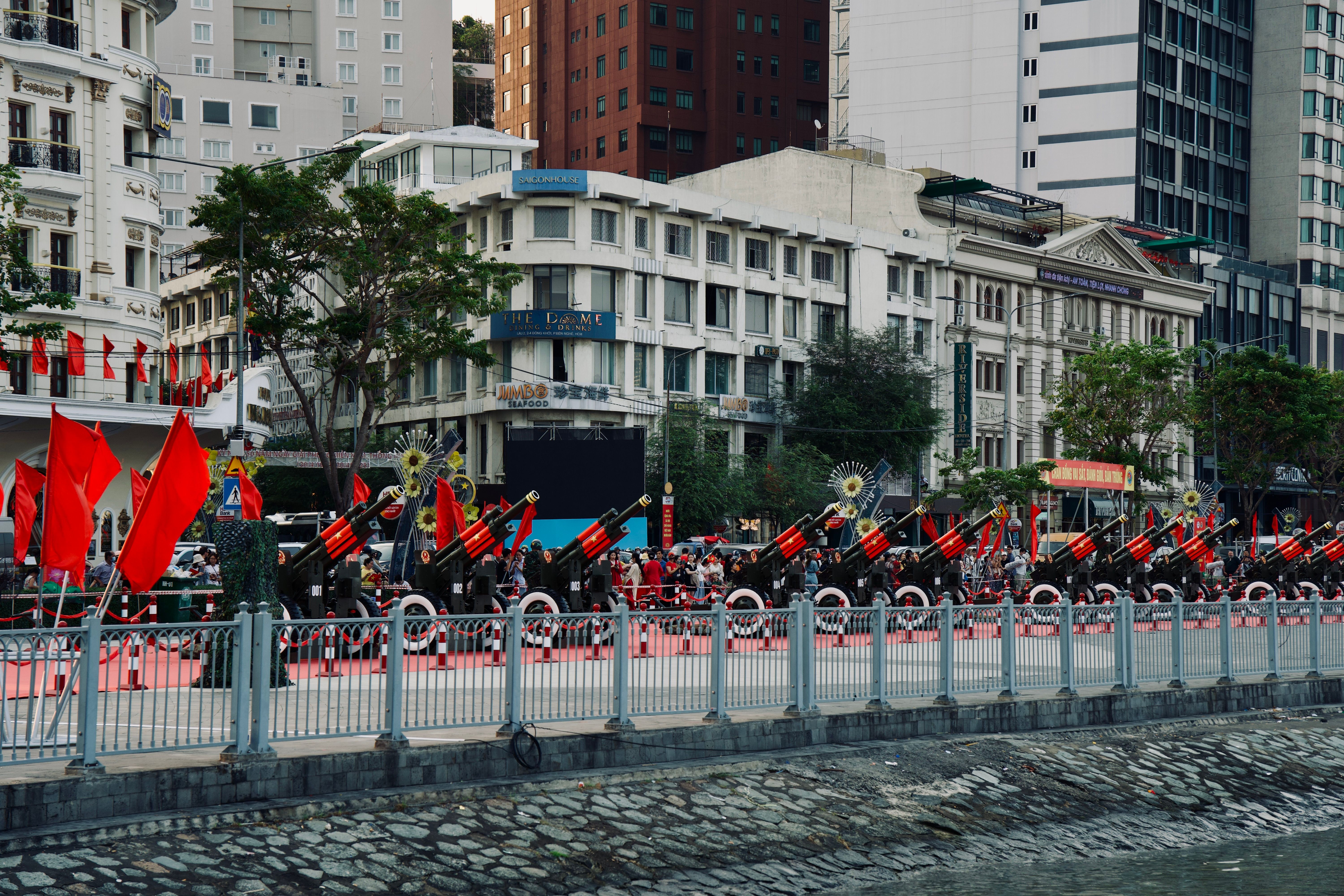 Cityscape Parade with Red Flags Display · Free Stock Photo