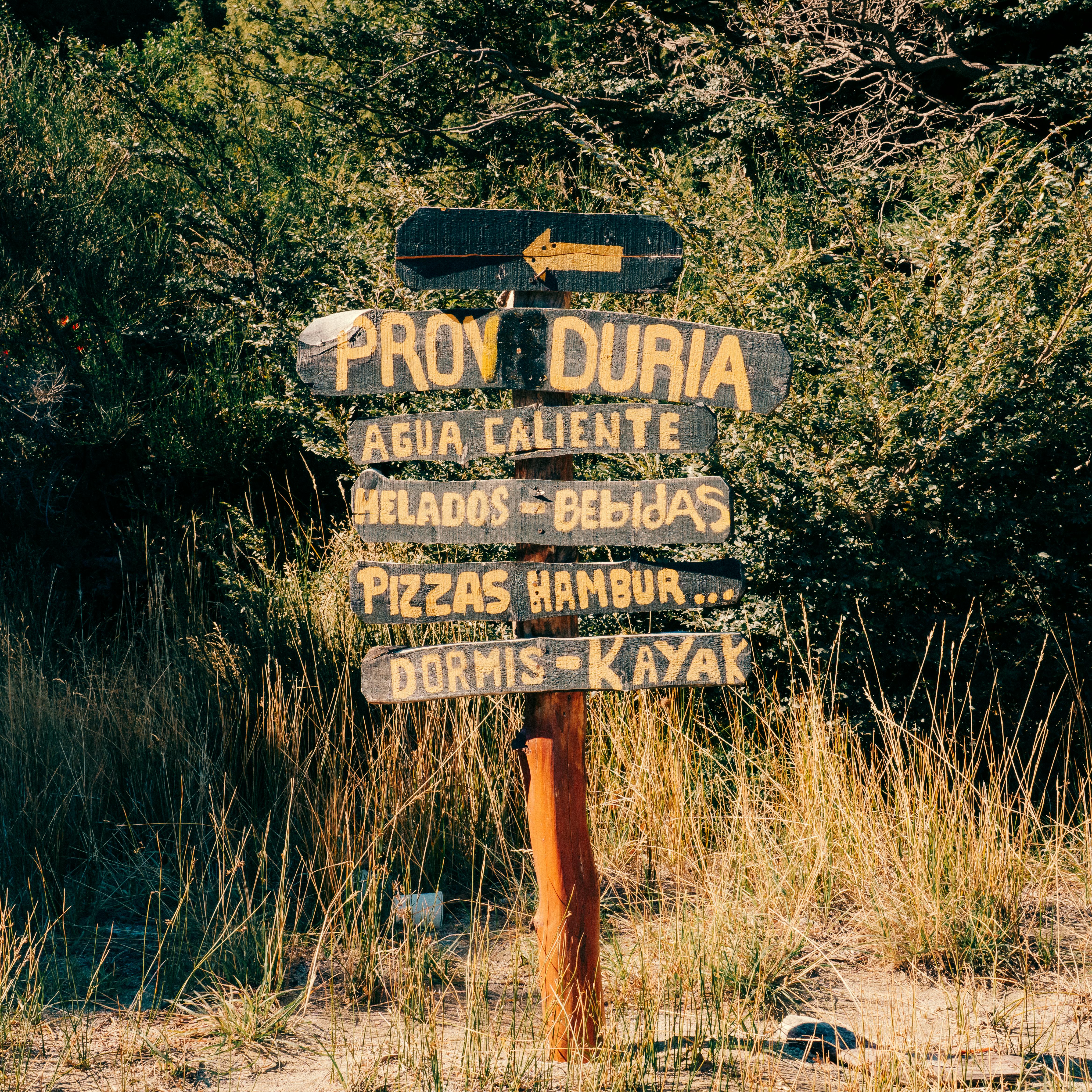 Rustic Wooden Signpost in Bariloche Scenic Area · Free Stock Photo