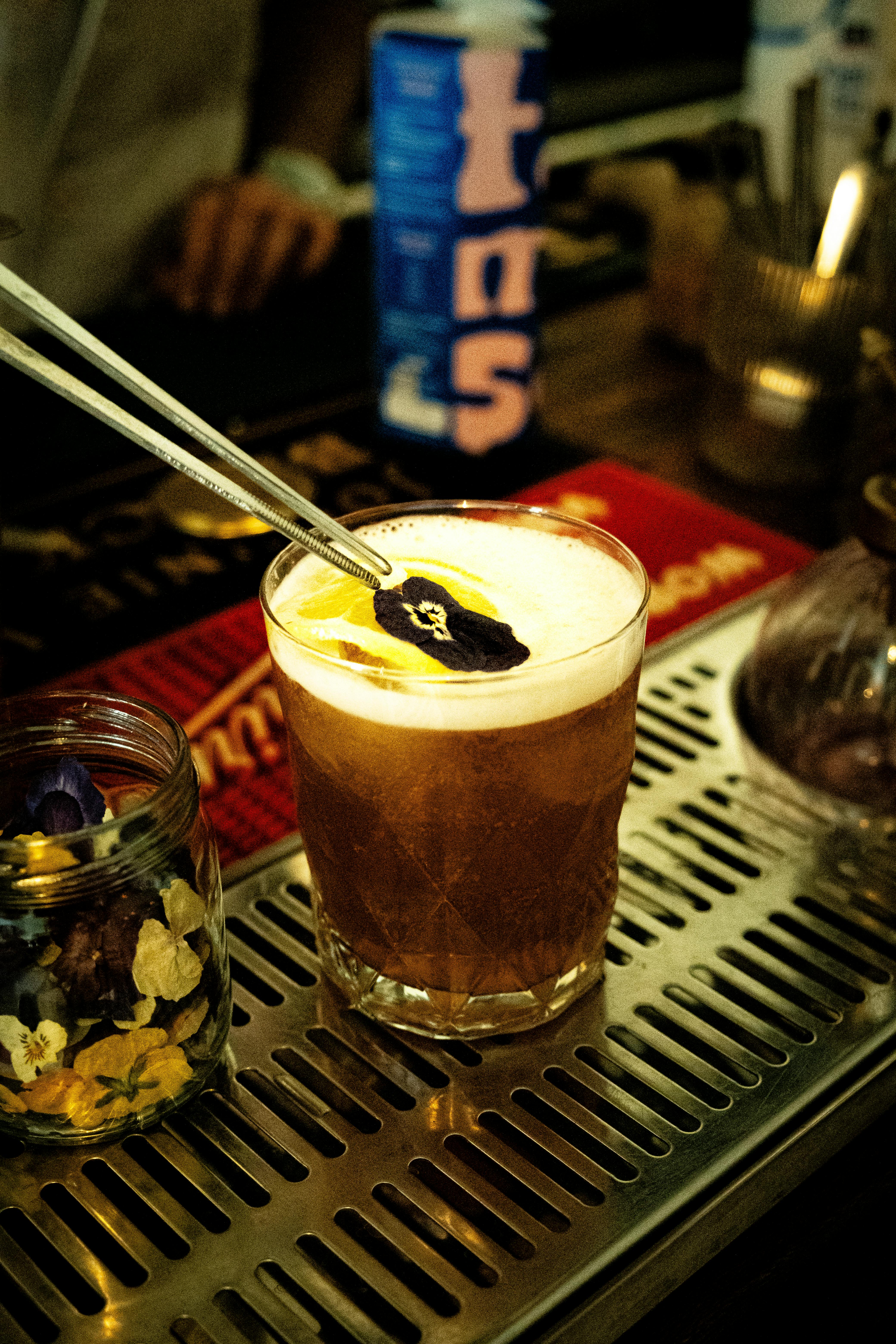 Artisan Cocktail with Edible Flower Garnish in Bar Setting · Free Stock ...