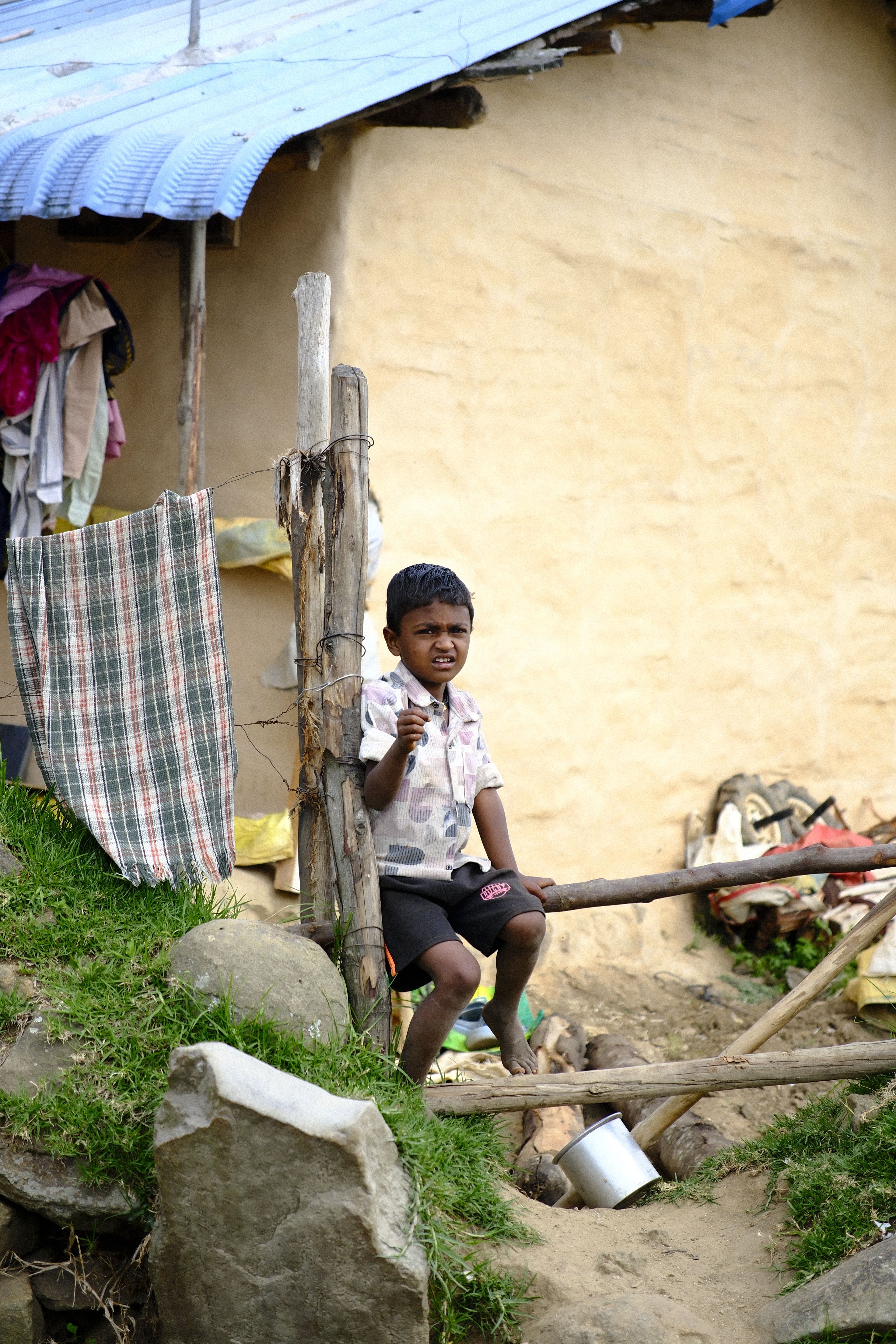 Boy Sitting Outside House in Kodaikanal · Free Stock Photo