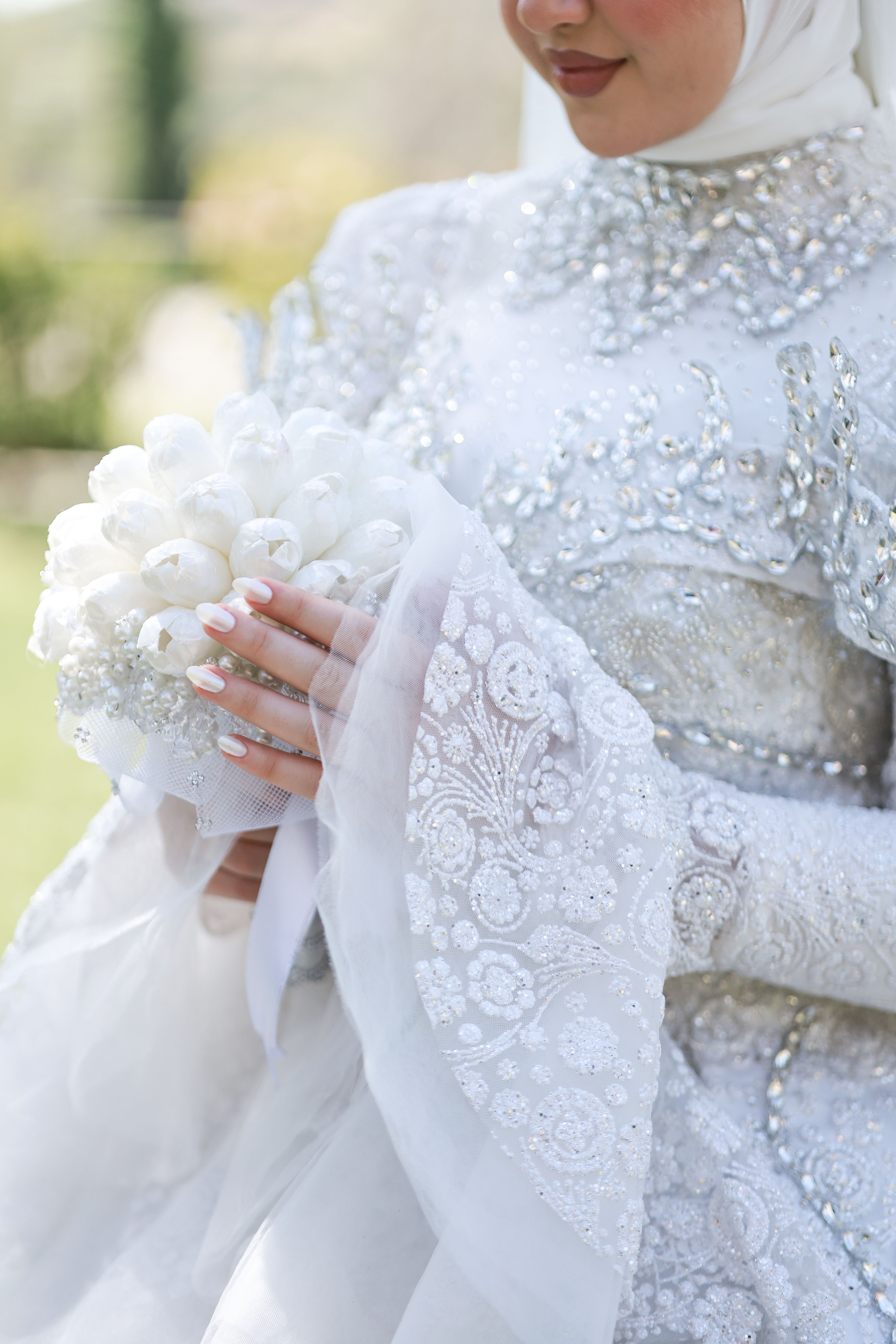 Elegant Bride in Ornate White Gown with Bouquet · Free Stock Photo