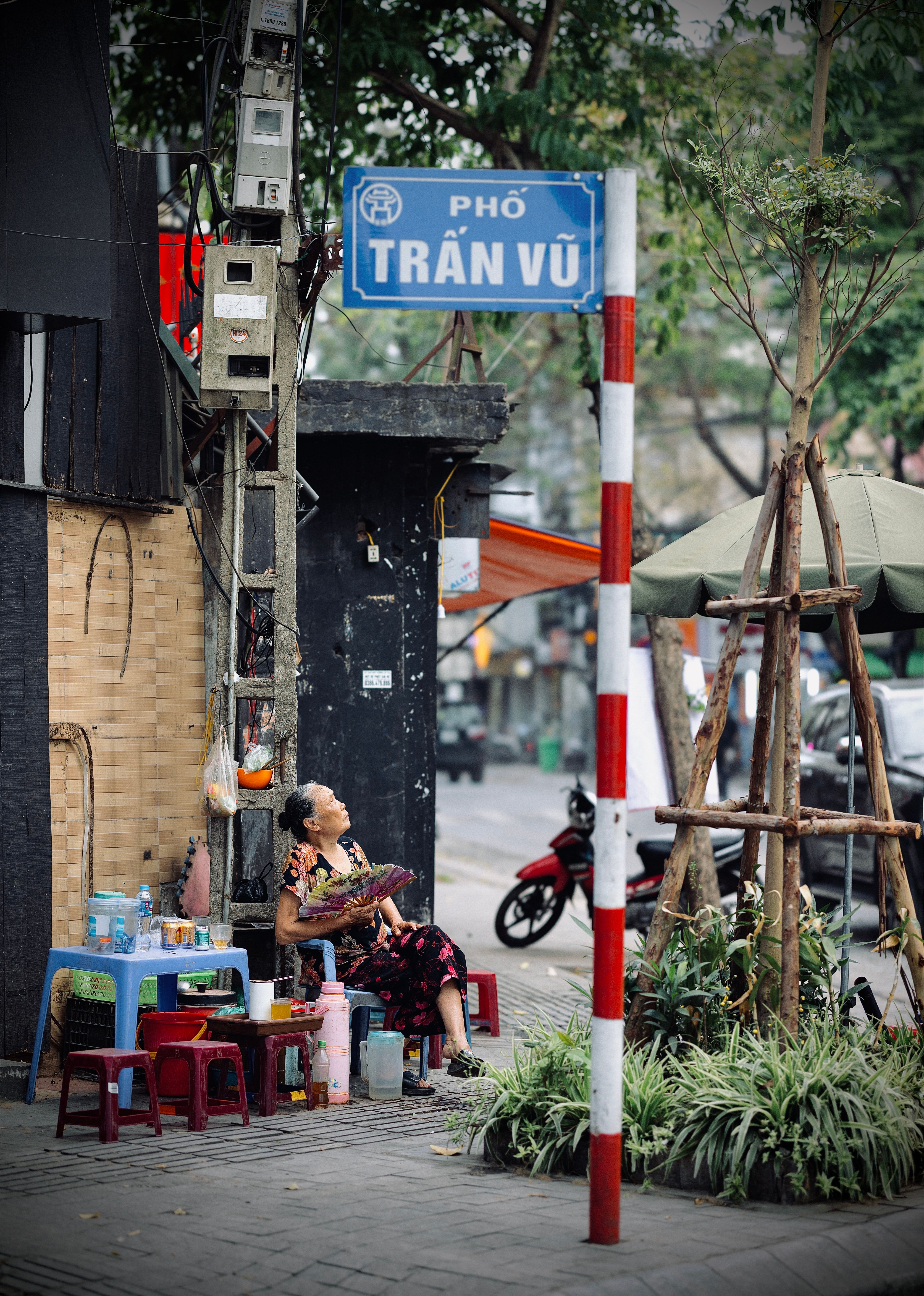 Street Scene in Hanoi with Local Vendor · Free Stock Photo