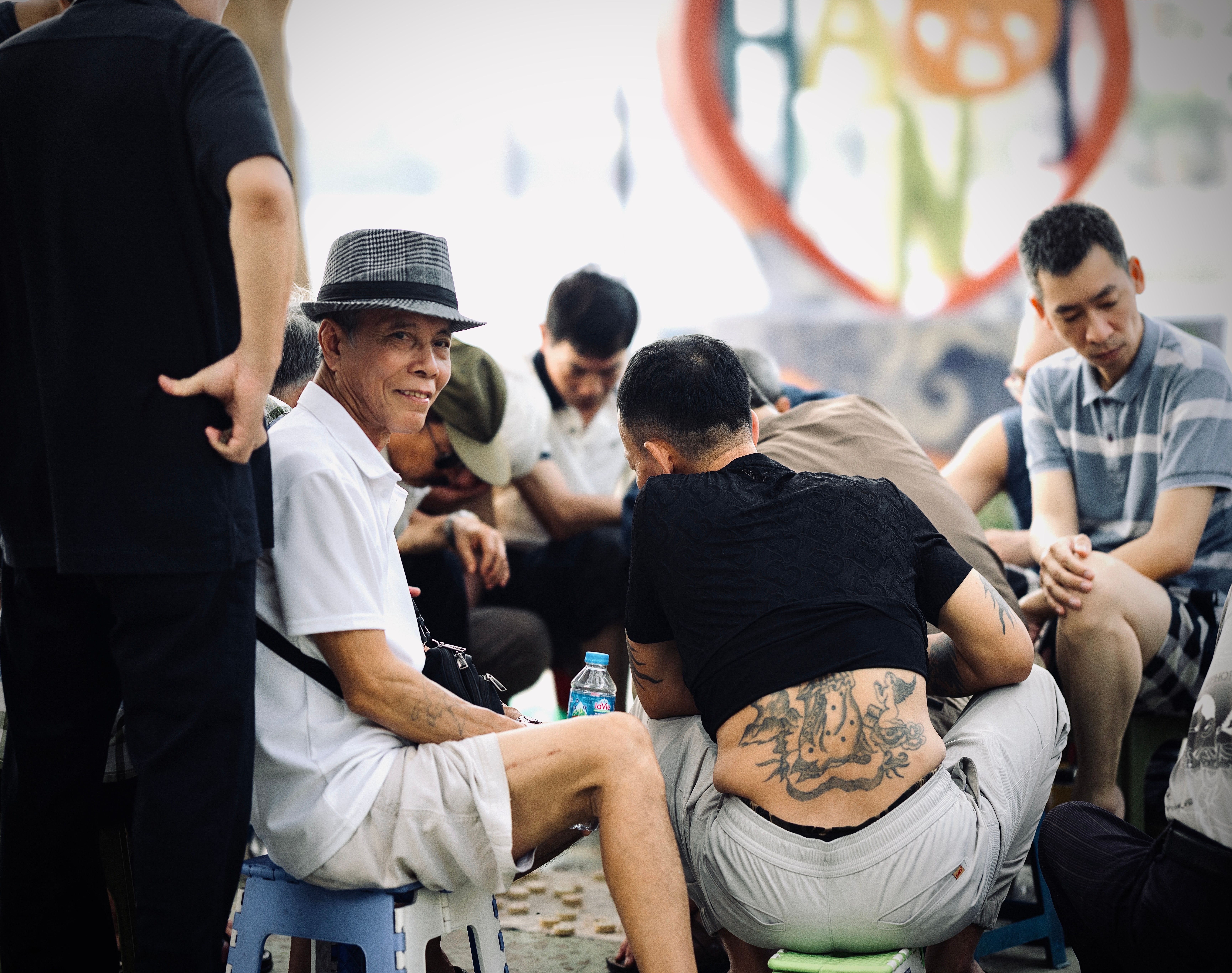 Men Socializing Outdoors Playing a Game · Free Stock Photo