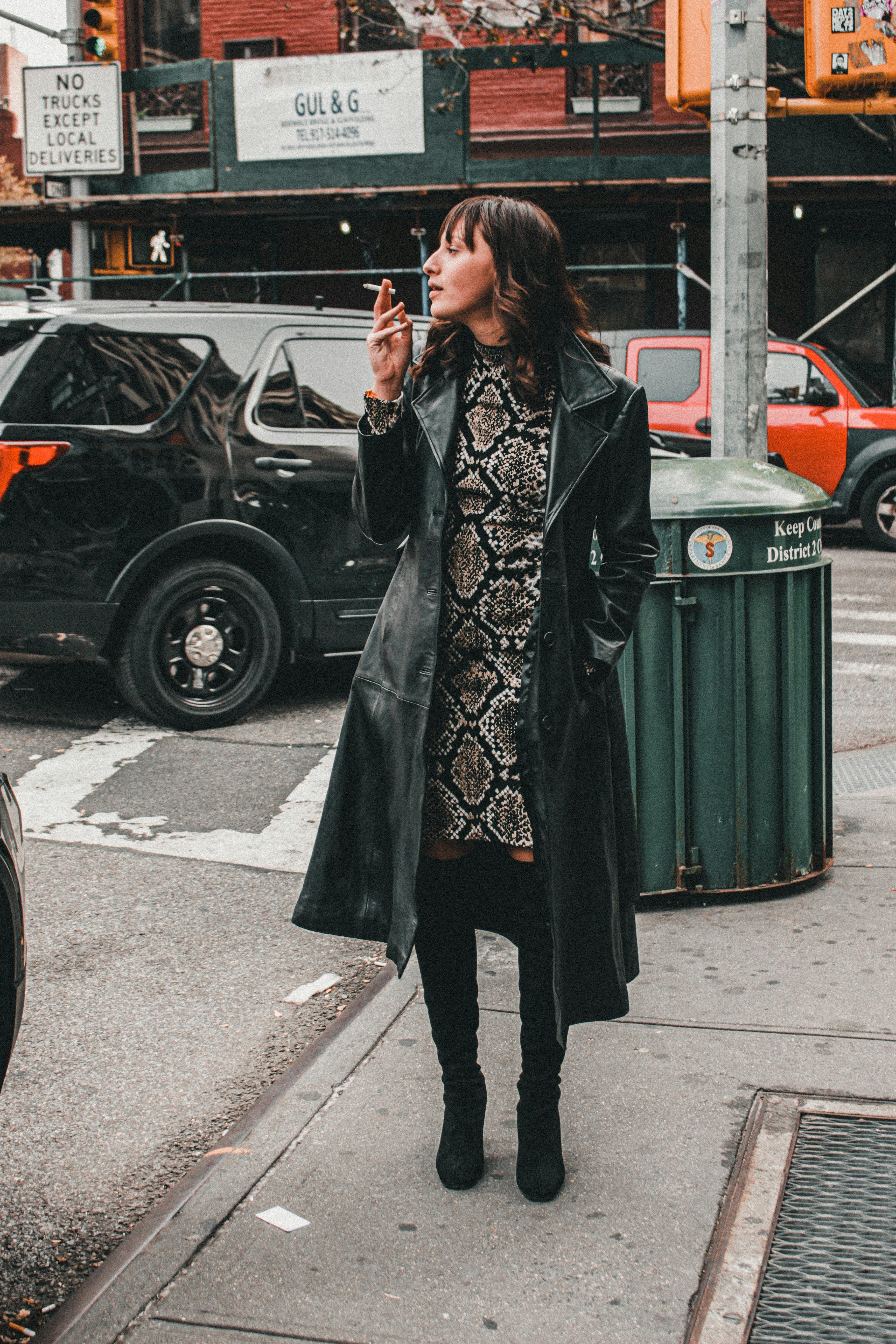 Woman Wearing Black Coat Smoking on Street · Free Stock Photo