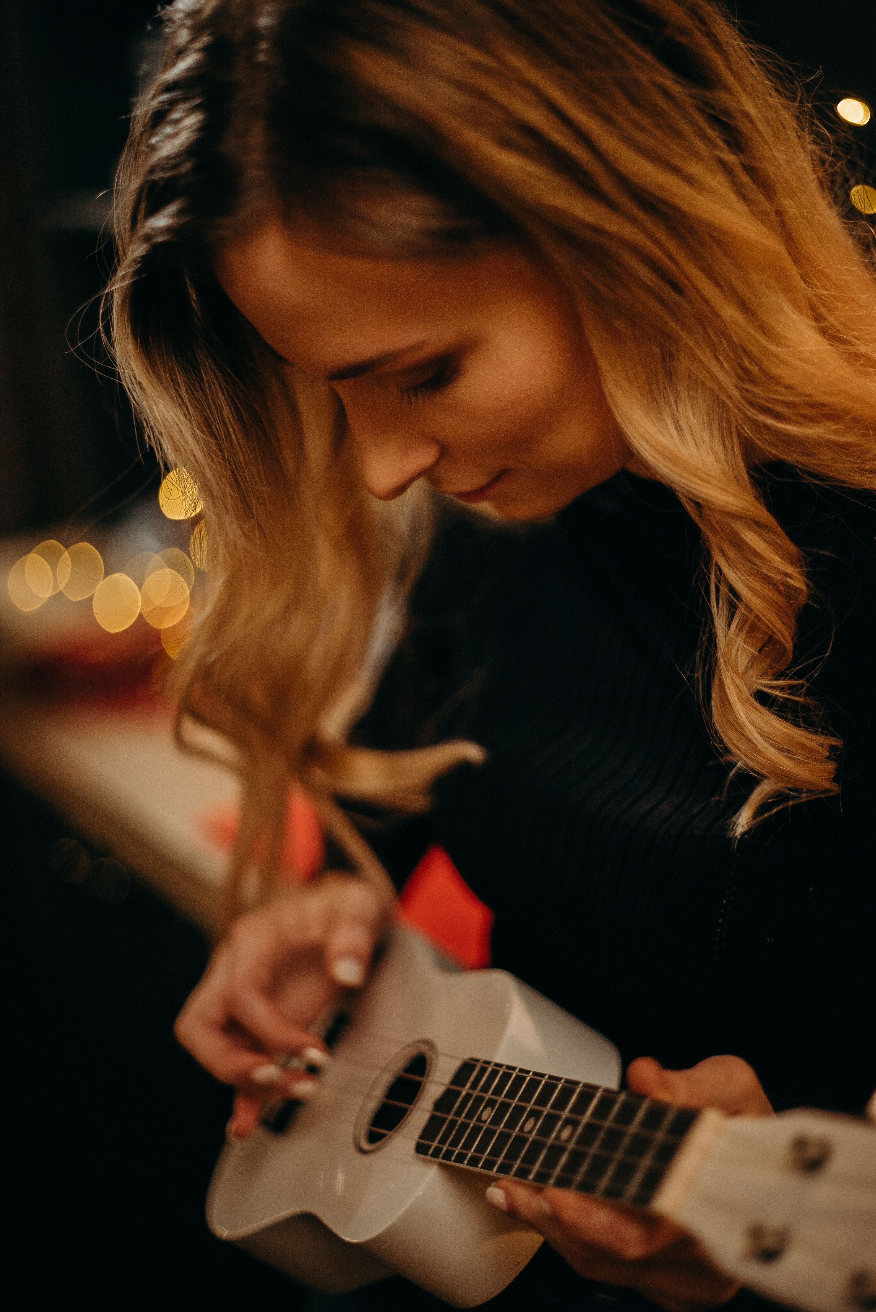 Close-up Photo of Woman Playing Ukulele · Free Stock Photo