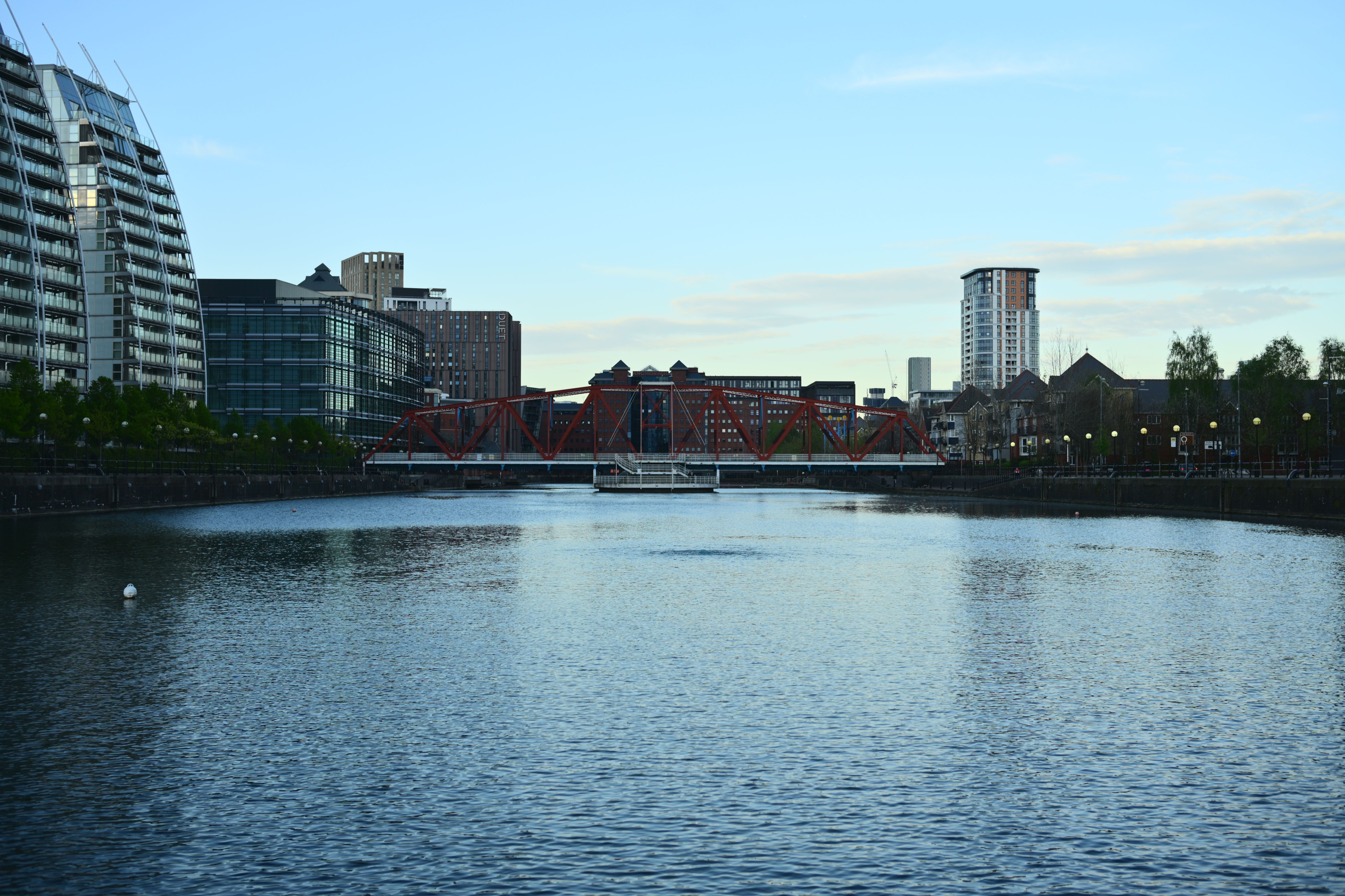 Urban River View with Bridge at Dusk · Free Stock Photo