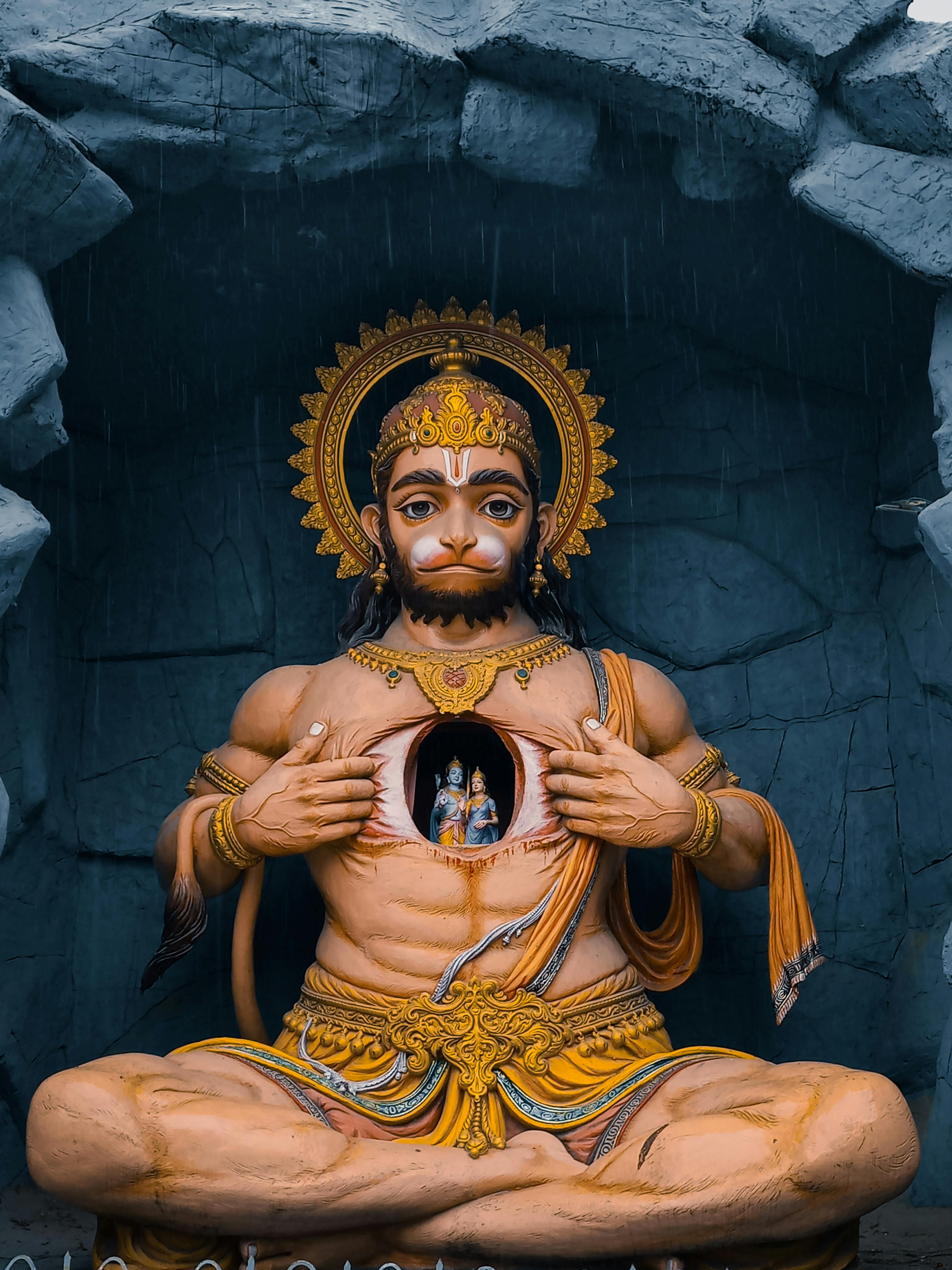 Statue of Hanuman Displaying Devotion Scene · Free Stock Photo