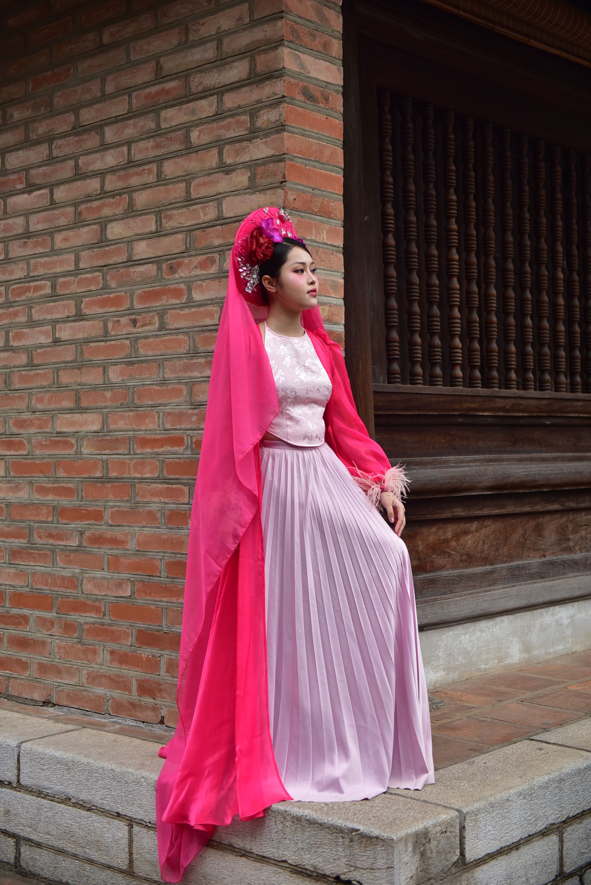 Young Woman in Traditional Pink Attire Outdoors · Free Stock Photo