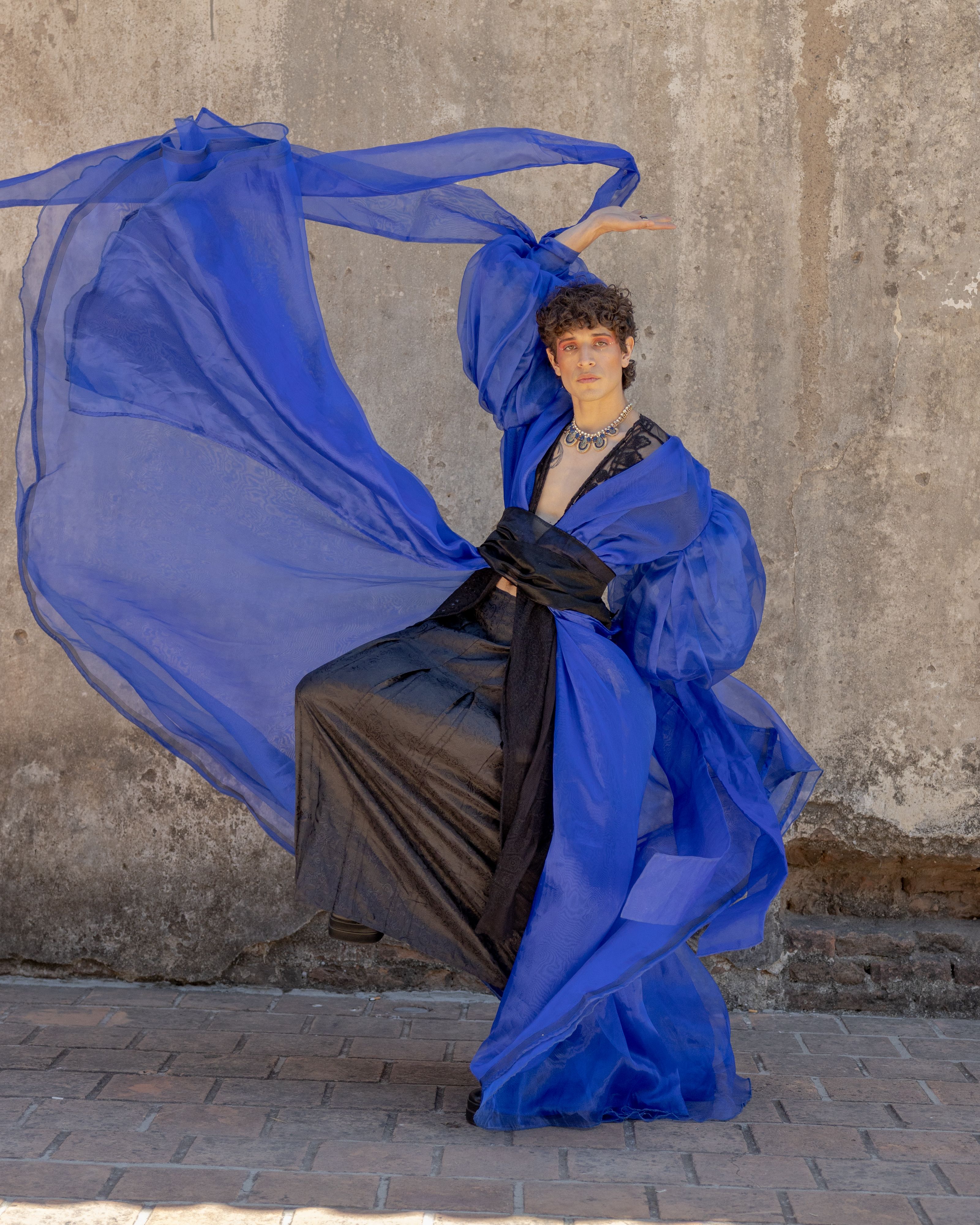 Elegant Dance Motion in Flowing Blue Dress · Free Stock Photo
