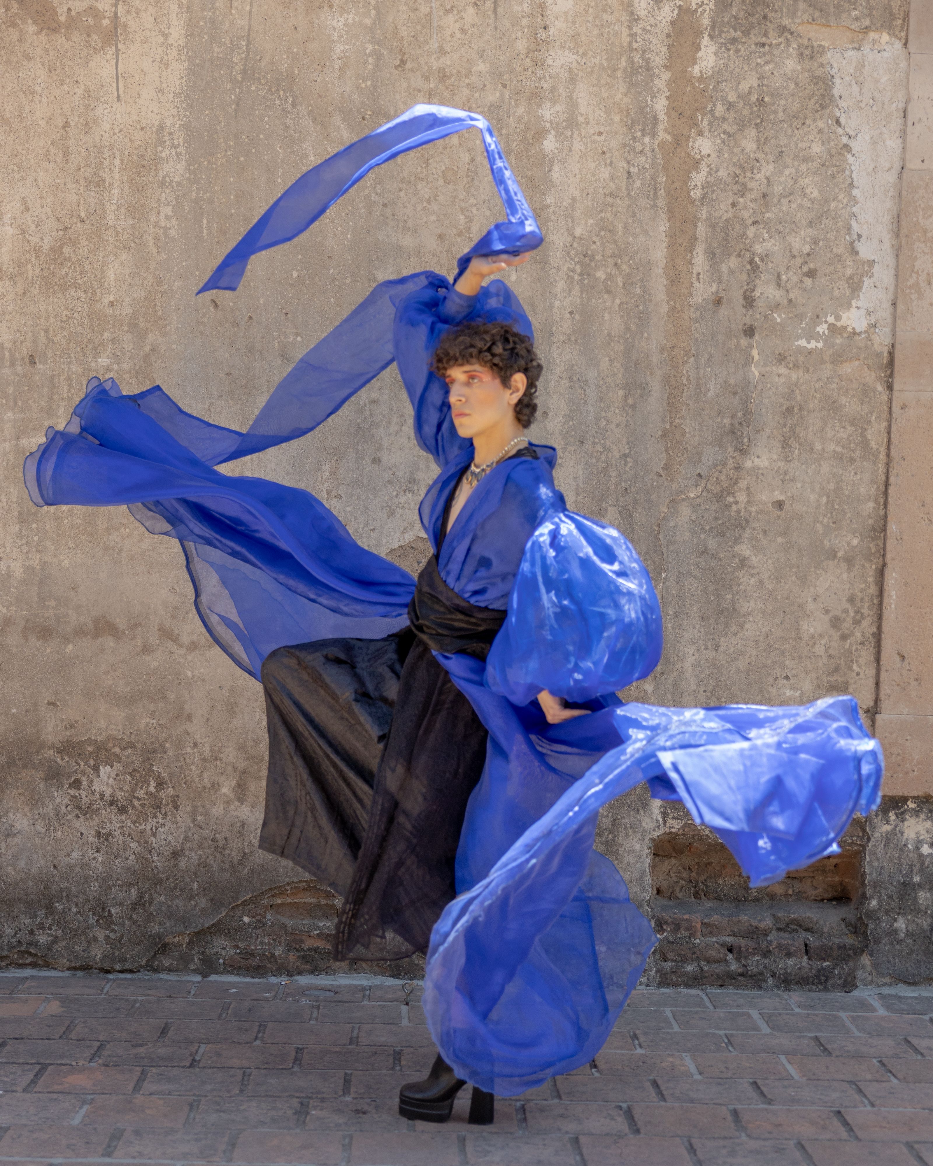 Elegant Dance in Vibrant Flowing Blue Dress · Free Stock Photo