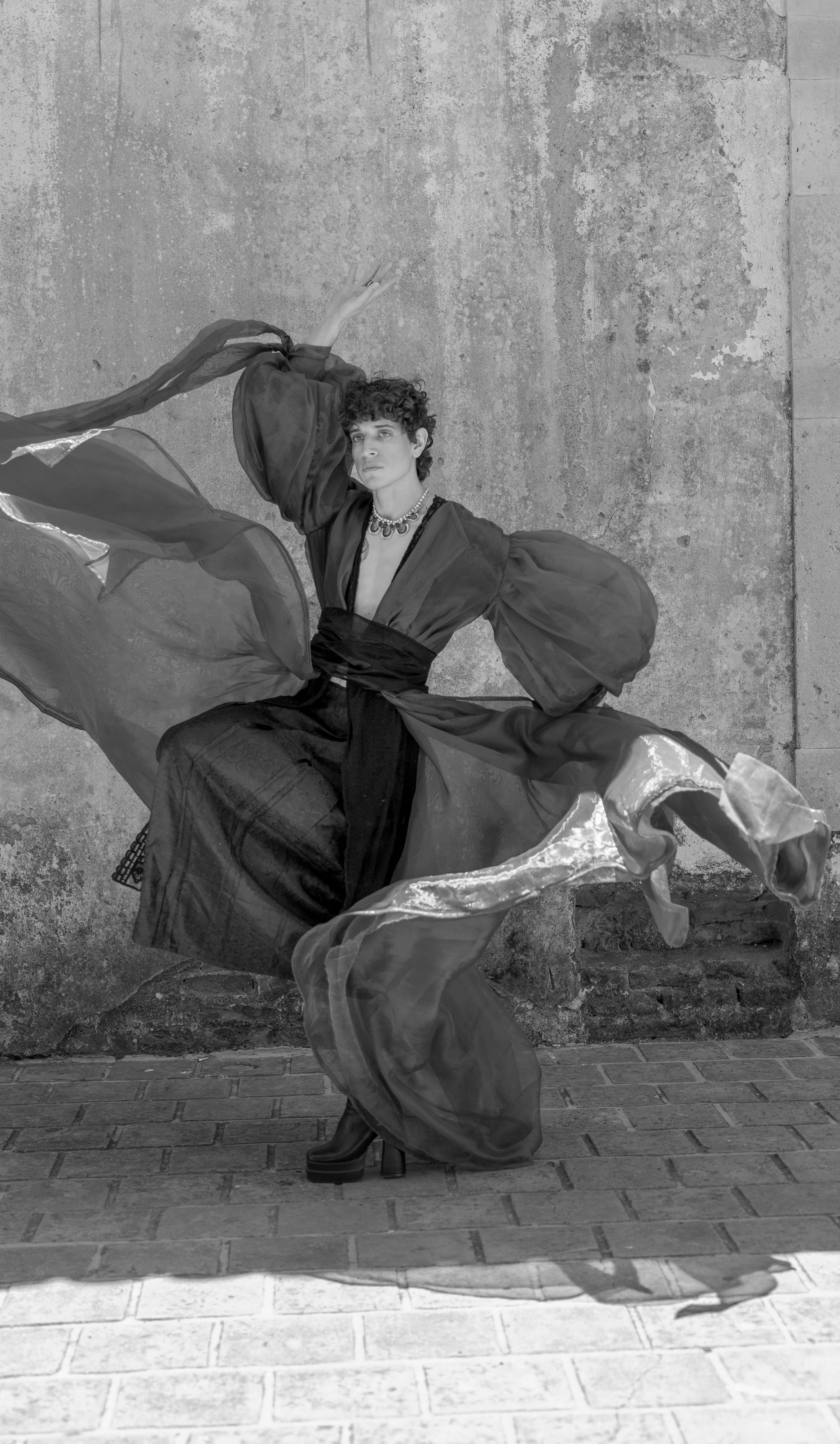 Elegant Dancer in Flowing Garment Mid-Performance · Free Stock Photo
