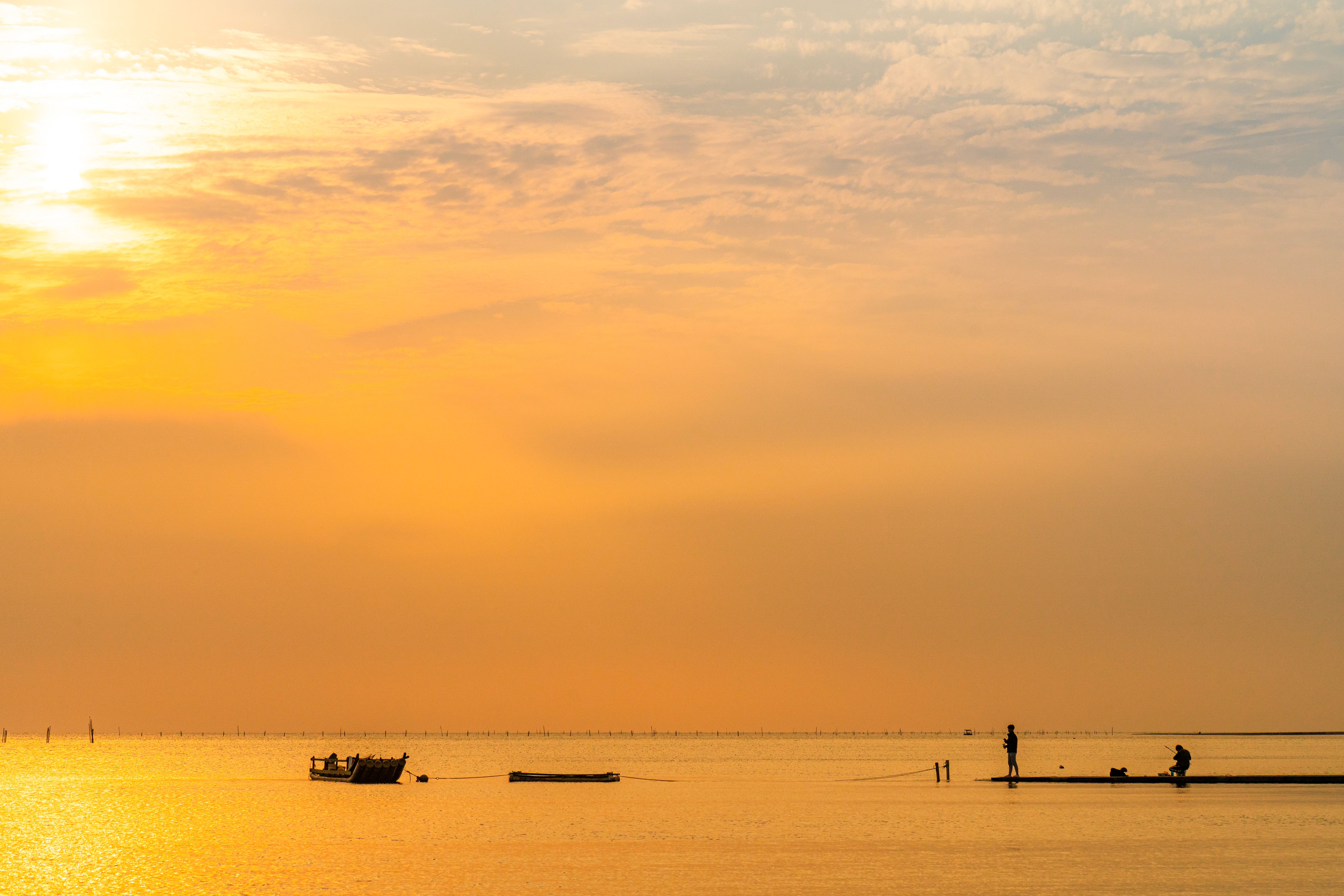 Tranquil Taiwan Sunset with Silhouettes on the Beach · Free Stock Photo