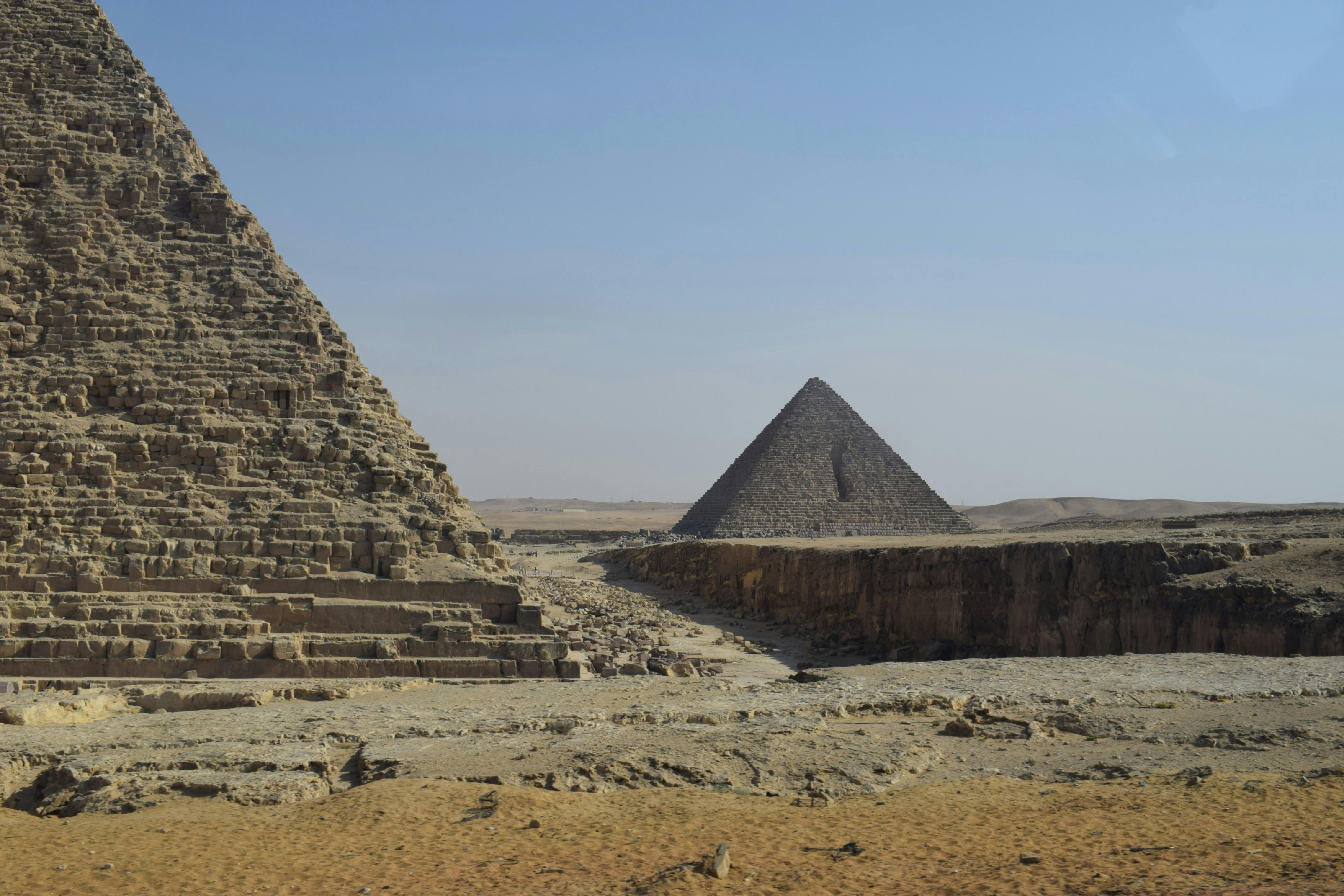 Ancient stone pyramids in dry sandy desert · Free Stock Photo