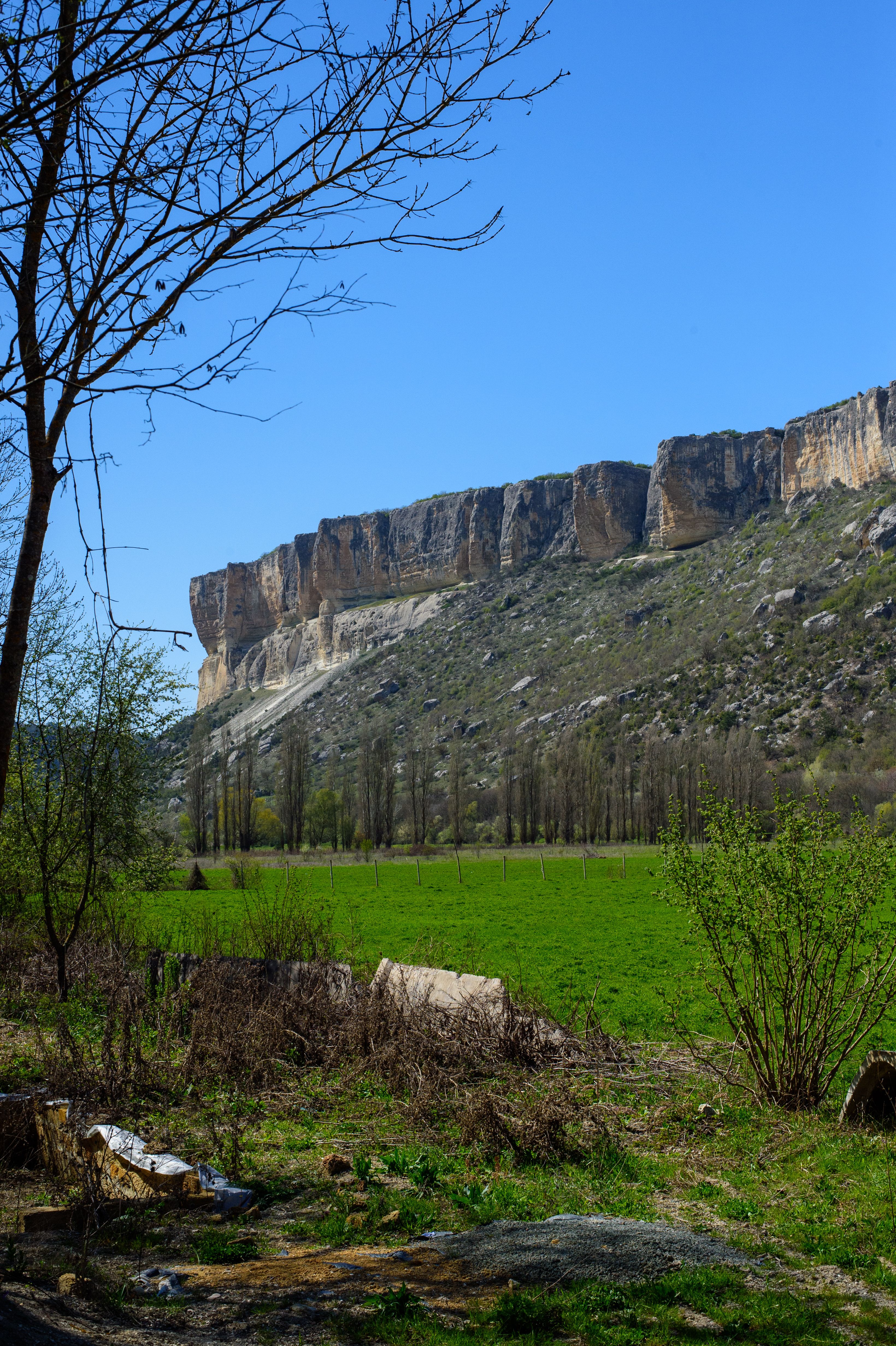 Majestic Limestone Cliff Under Clear Blue Sky · Free Stock Photo