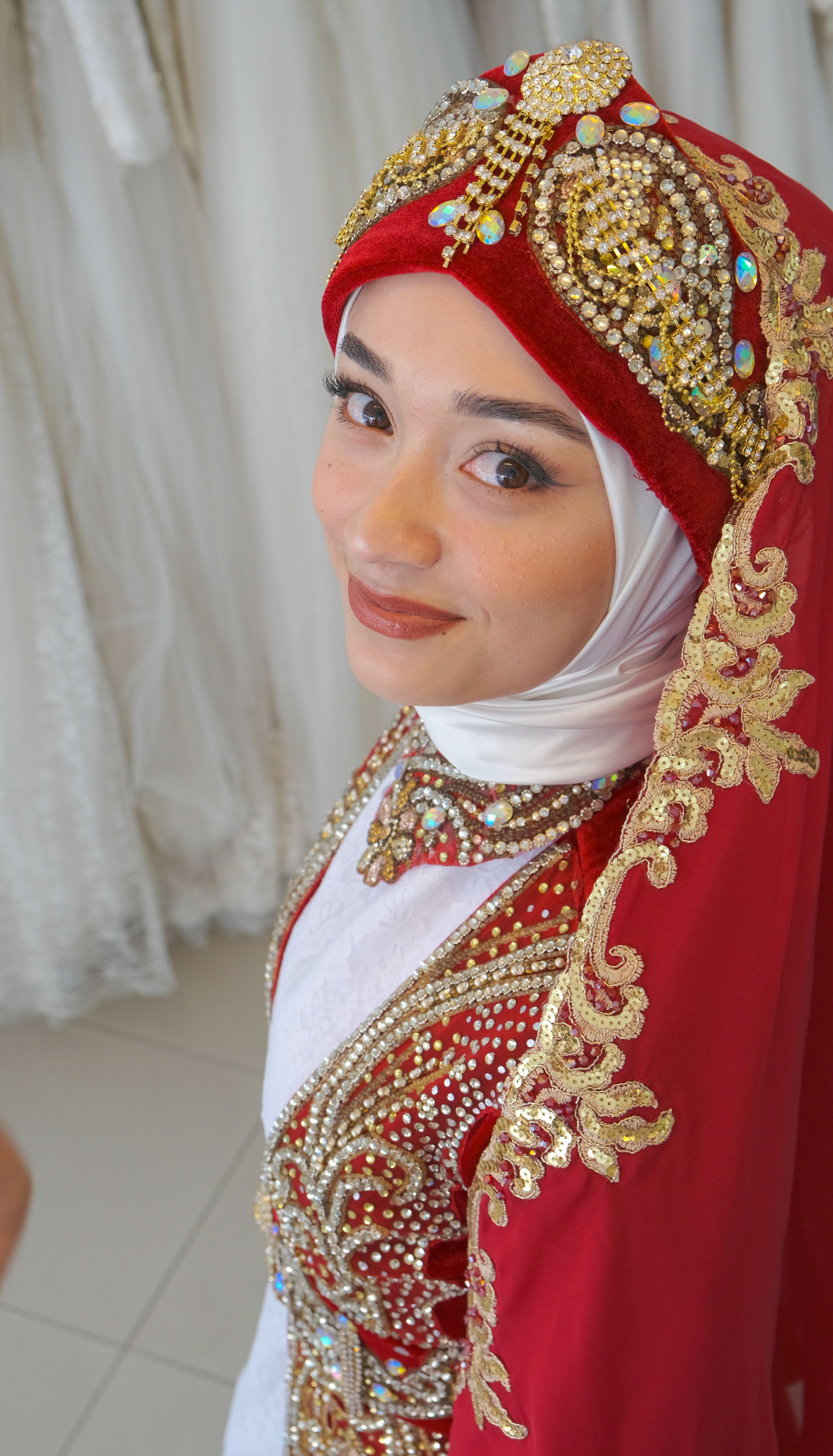 Bride in Traditional Red Turkish Attire Smiling · Free Stock Photo