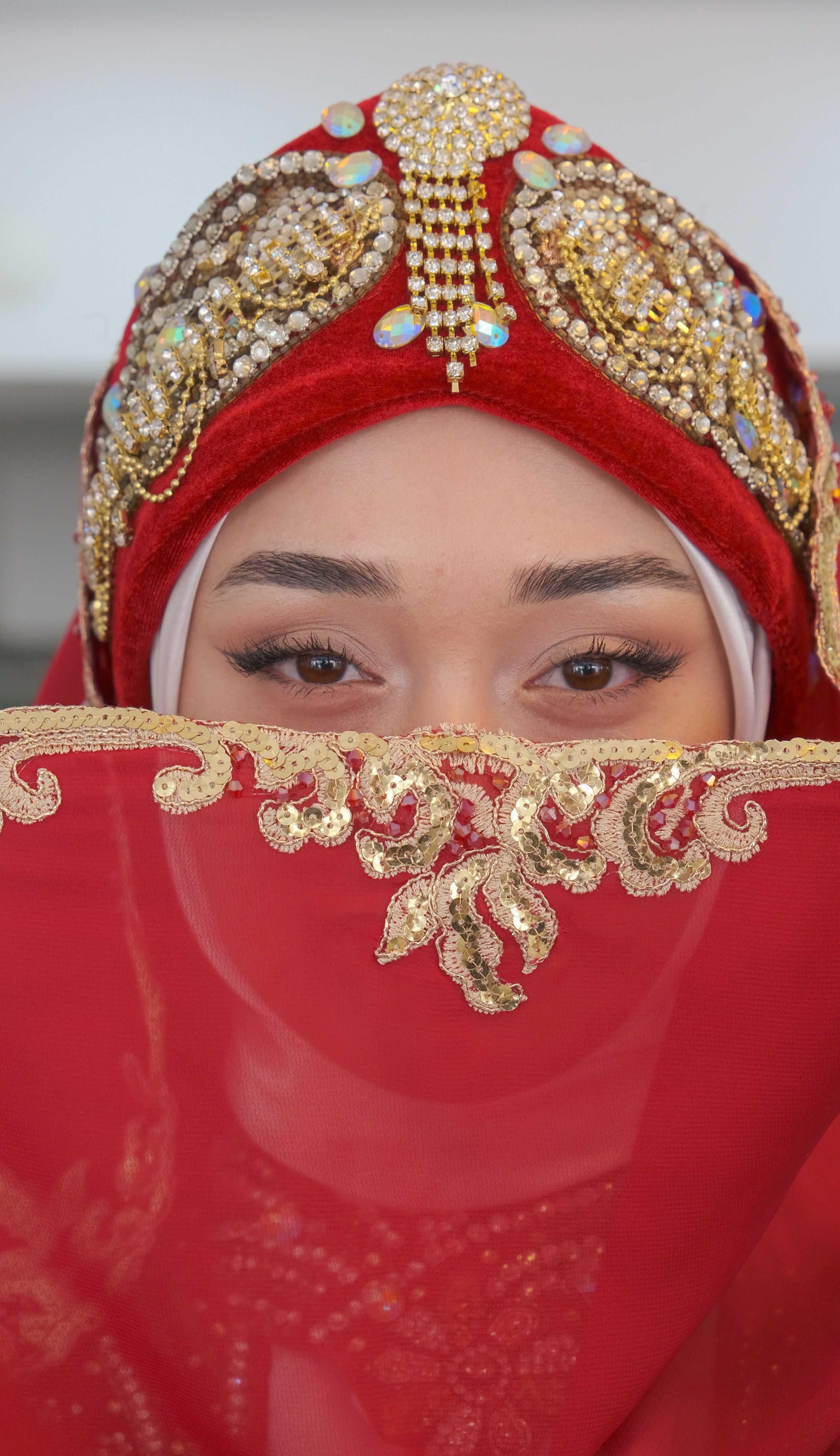 Bride in Traditional Red Turkish Attire Smiling · Free Stock Photo