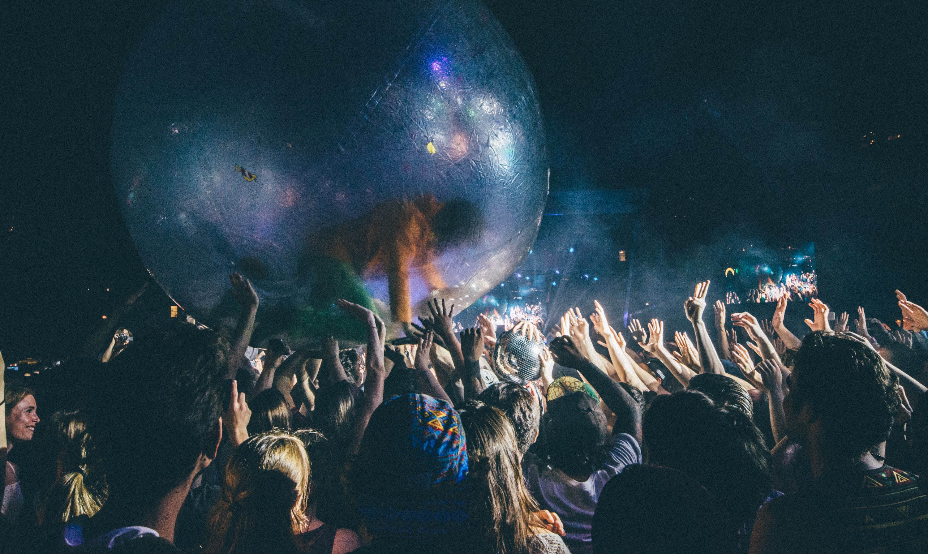Crowd of People Passing Big Rubber Ball with Person Inside · Free Stock ...