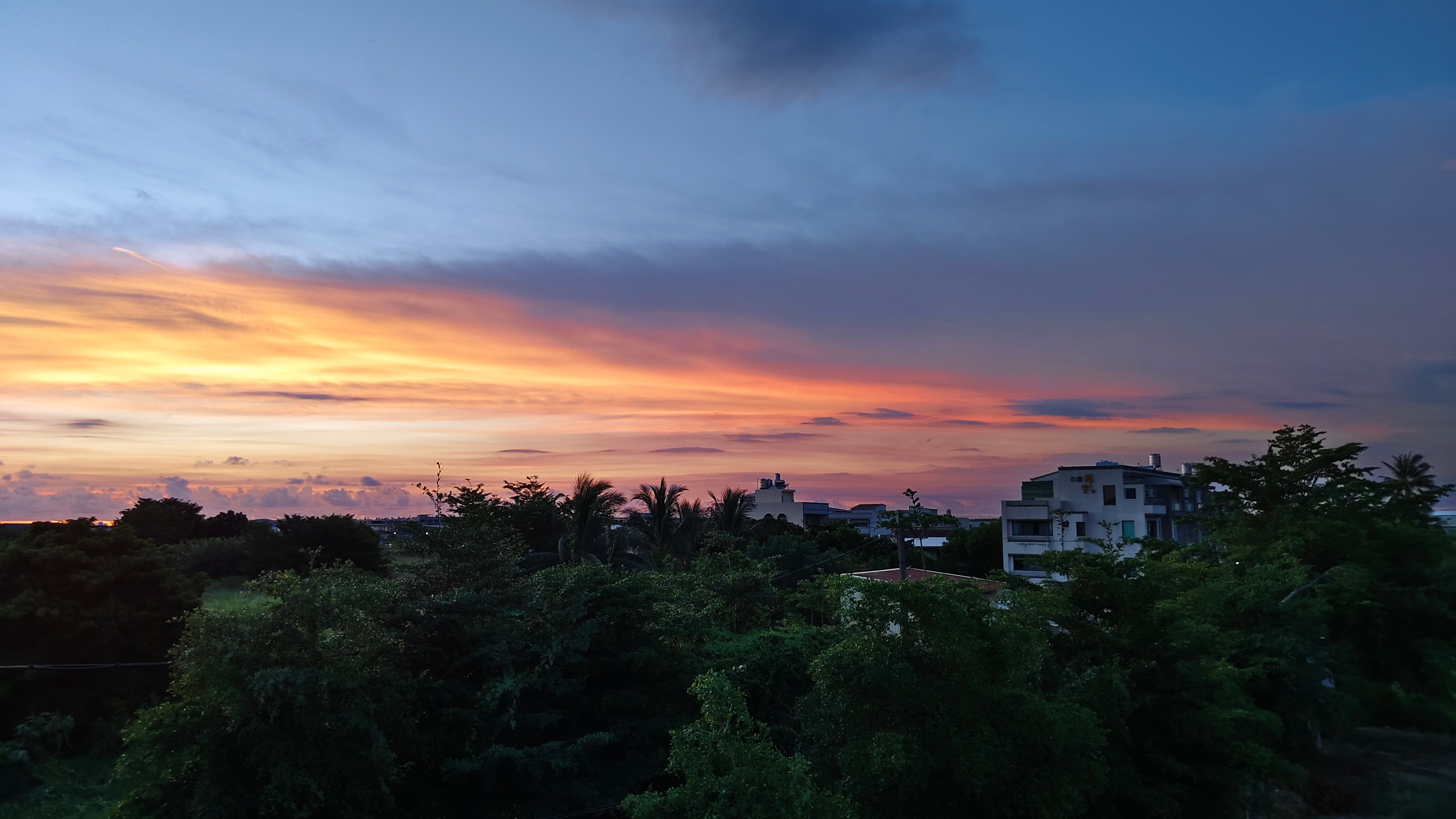 Taiwan Sunset Over Lush Urban Landscape · Free Stock Photo