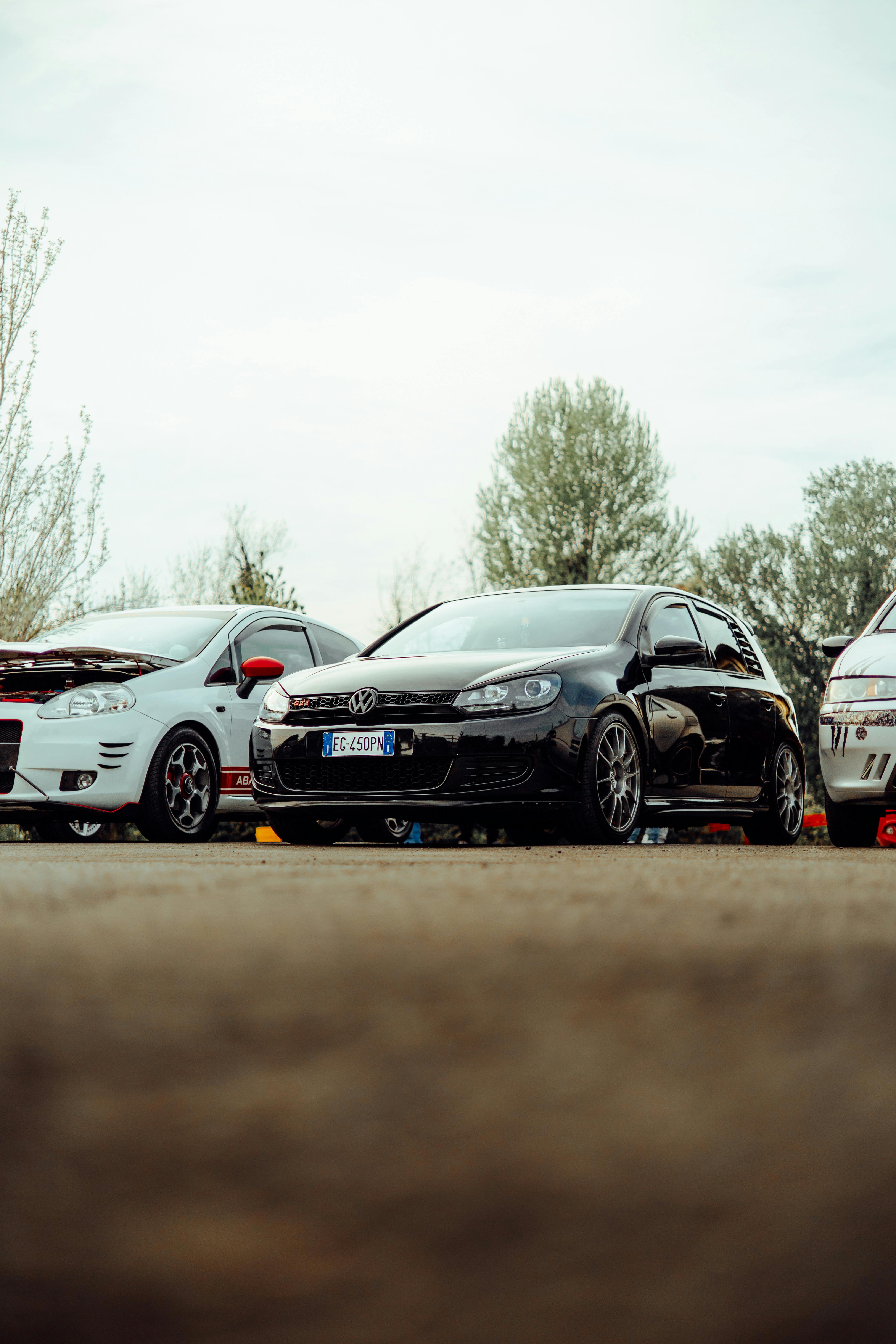 Sleek Cars Lined Up at Outdoor Auto Show · Free Stock Photo