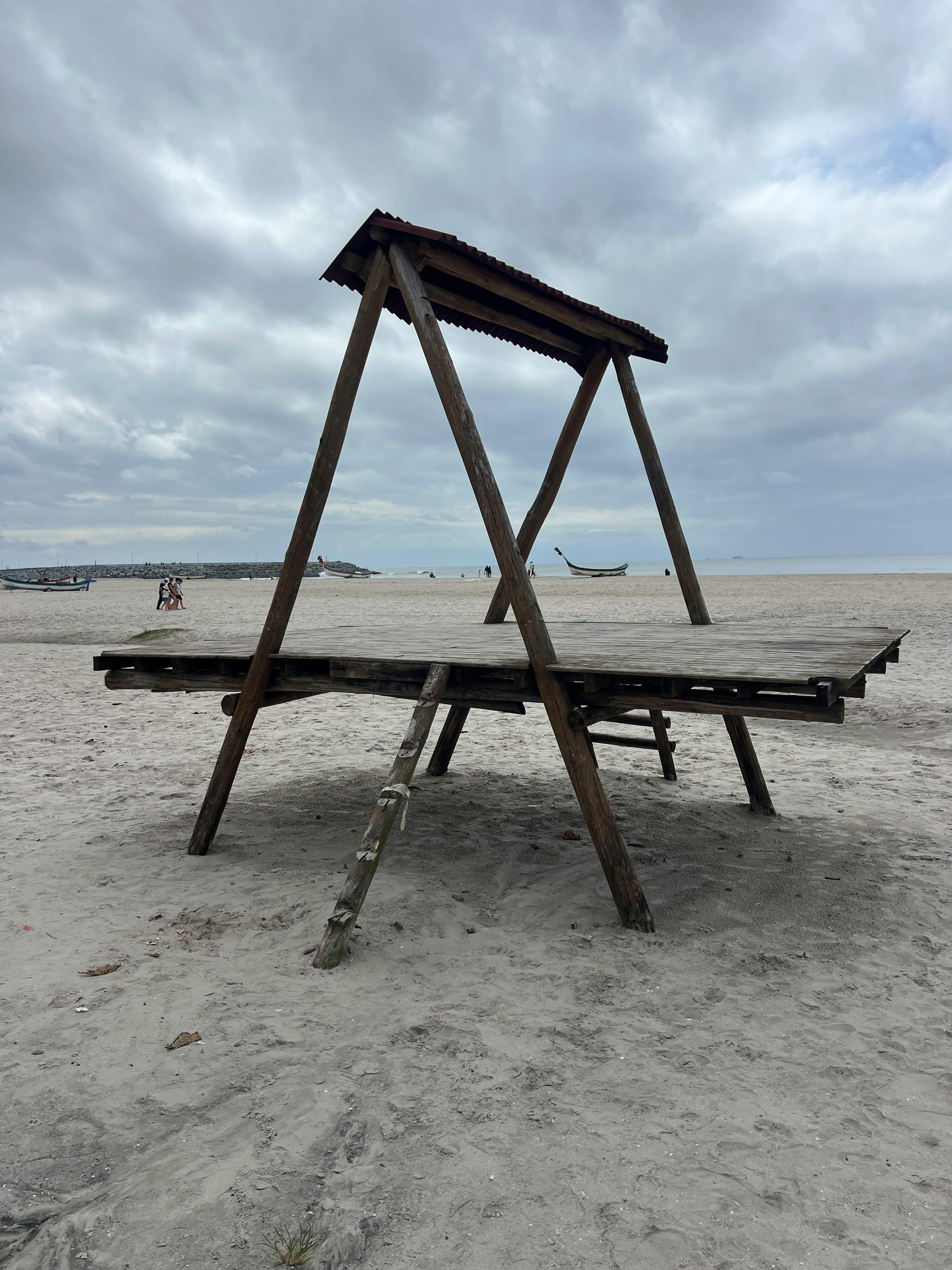 Rustic Wooden Structure on Sandy Beach · Free Stock Photo