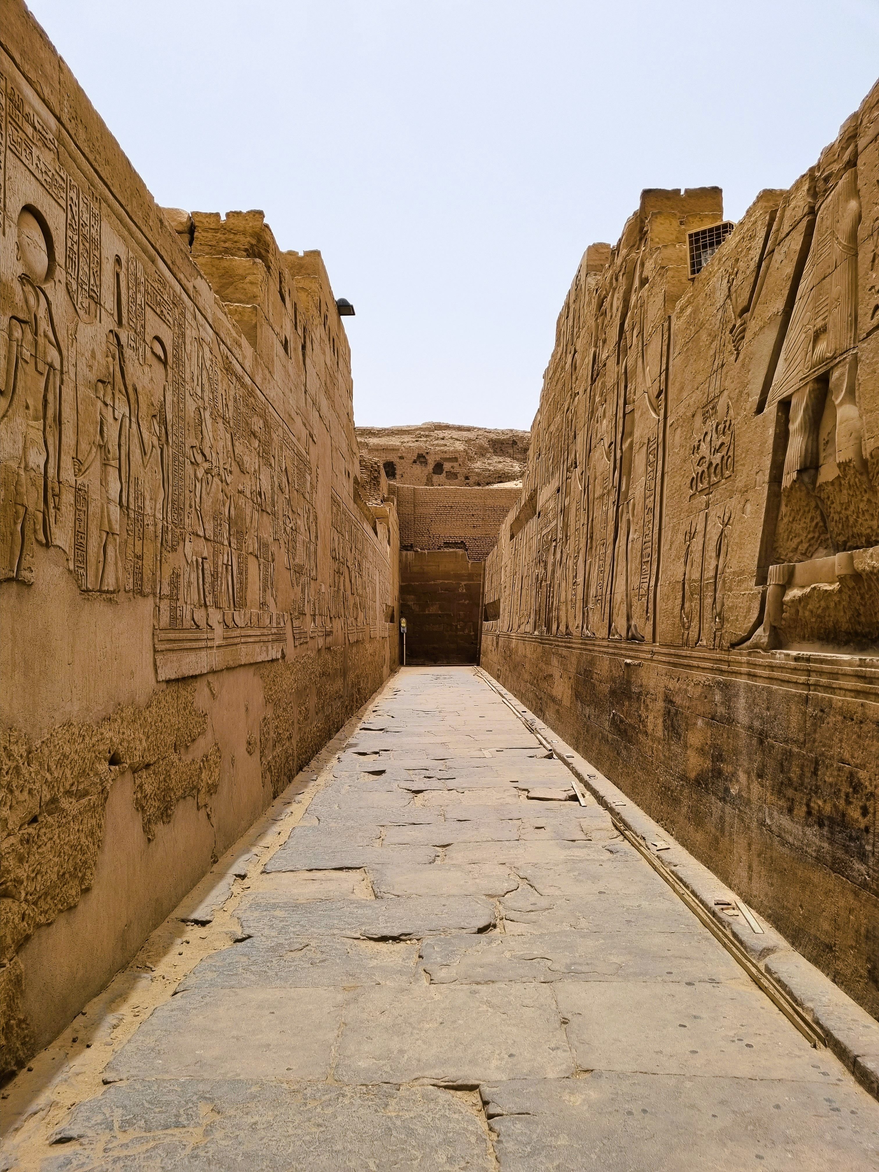 A Narrow Alley between Two Walls with Reliefs in a Temple · Free Stock ...