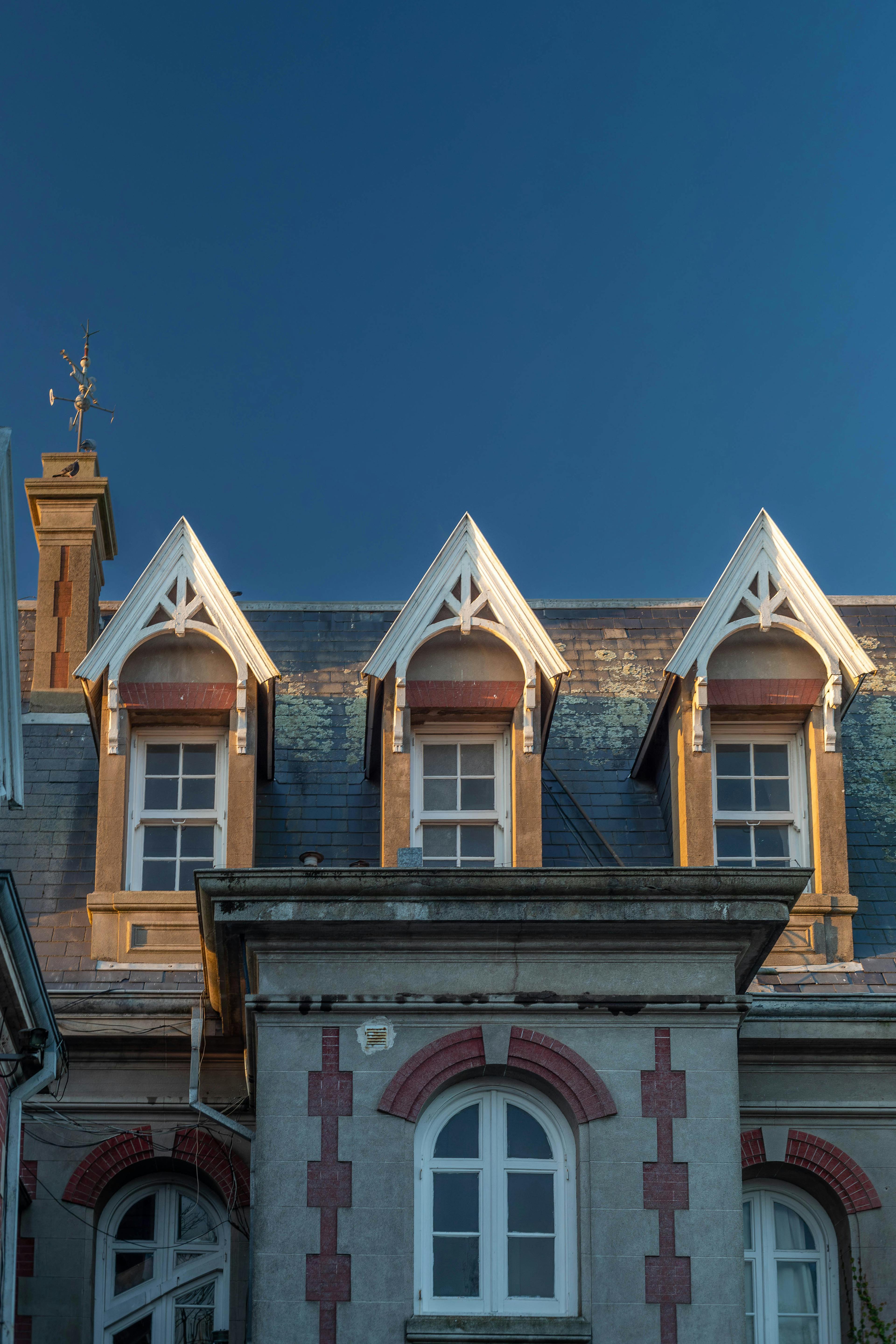 Elegant European Mansard Roof with Gables · Free Stock Photo
